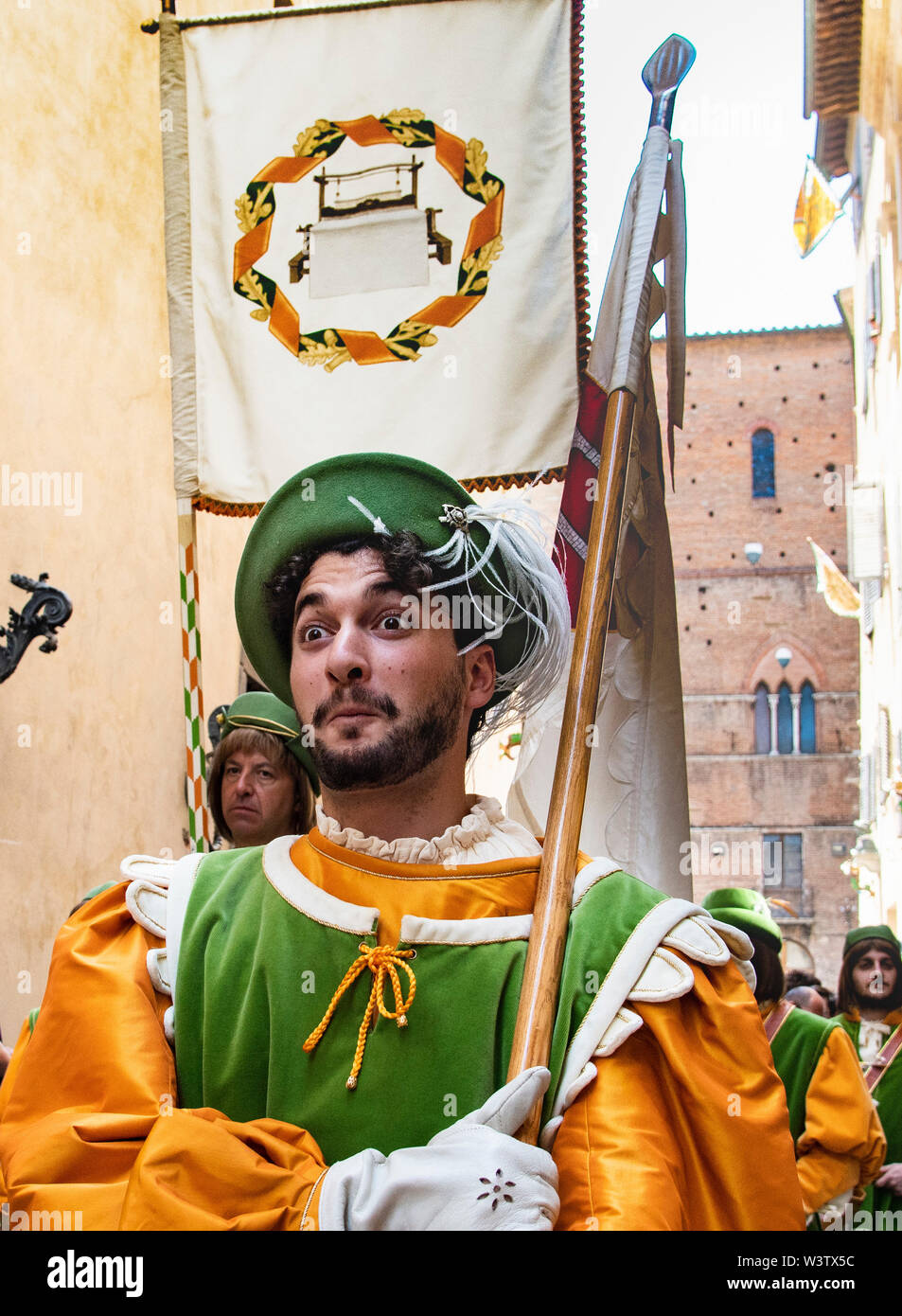 A young dressed in medieval garb and costume makes of funny and goofy ...
