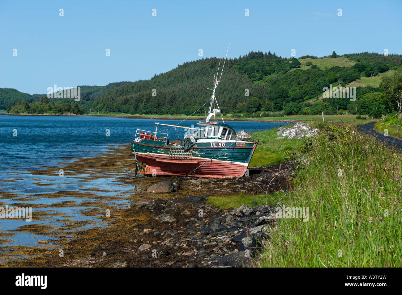 Old beached fishing boat on eastern shore of Loch Sween in Knapdale ...