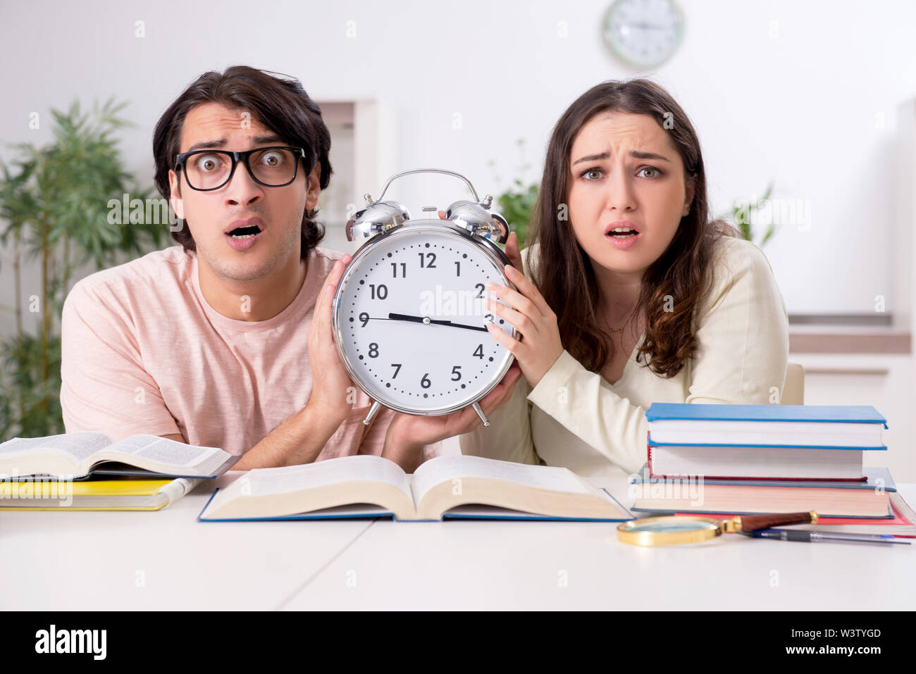 The students preparing for exam together at home Stock Photo - Alamy