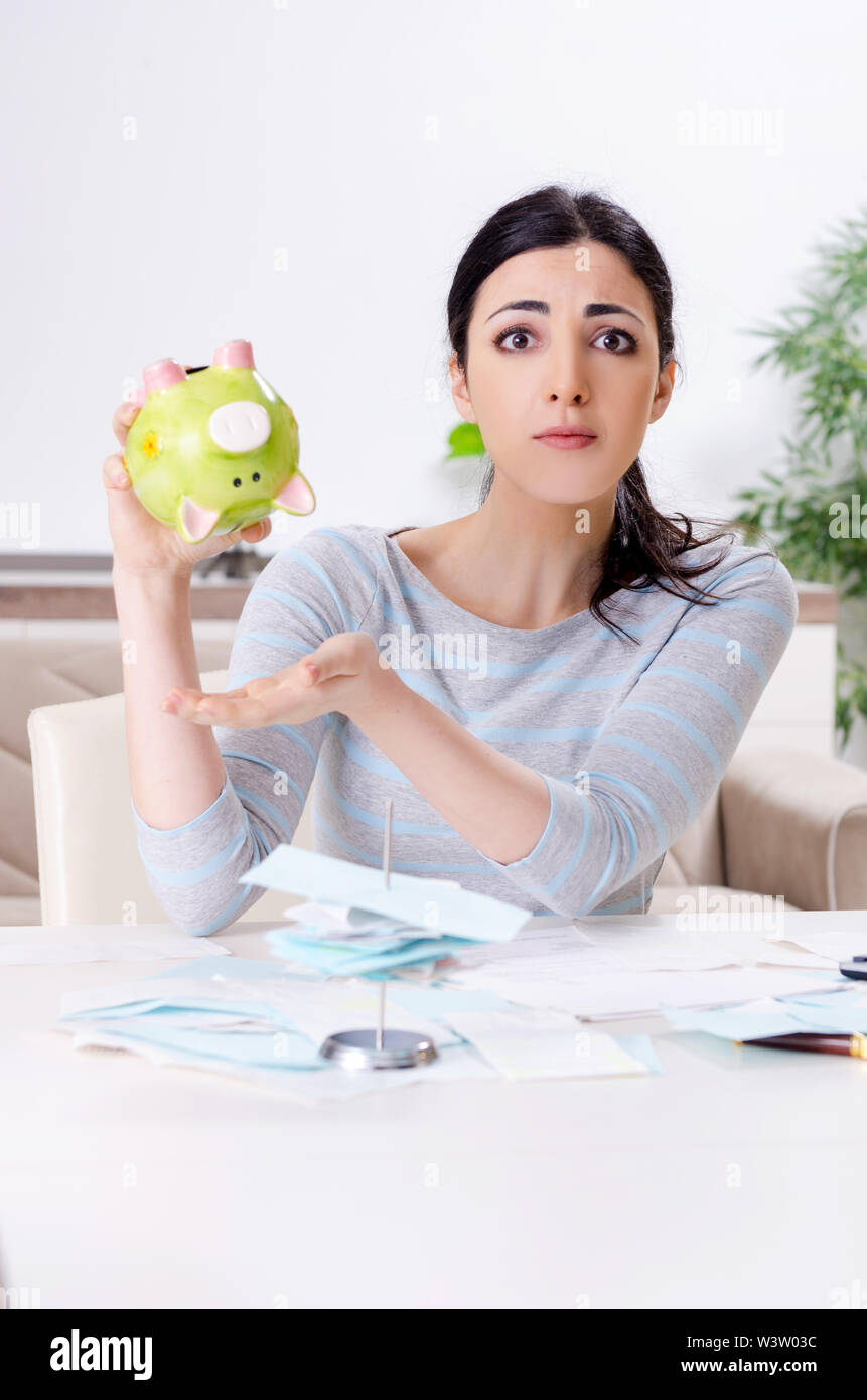 The young woman in budget planning concept Stock Photo - Alamy