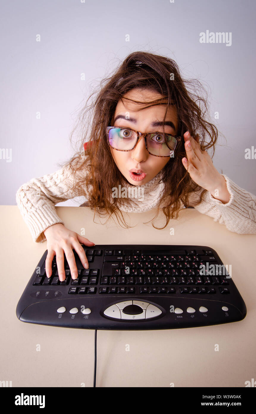 The funny nerd girl working on computer Stock Photo - Alamy