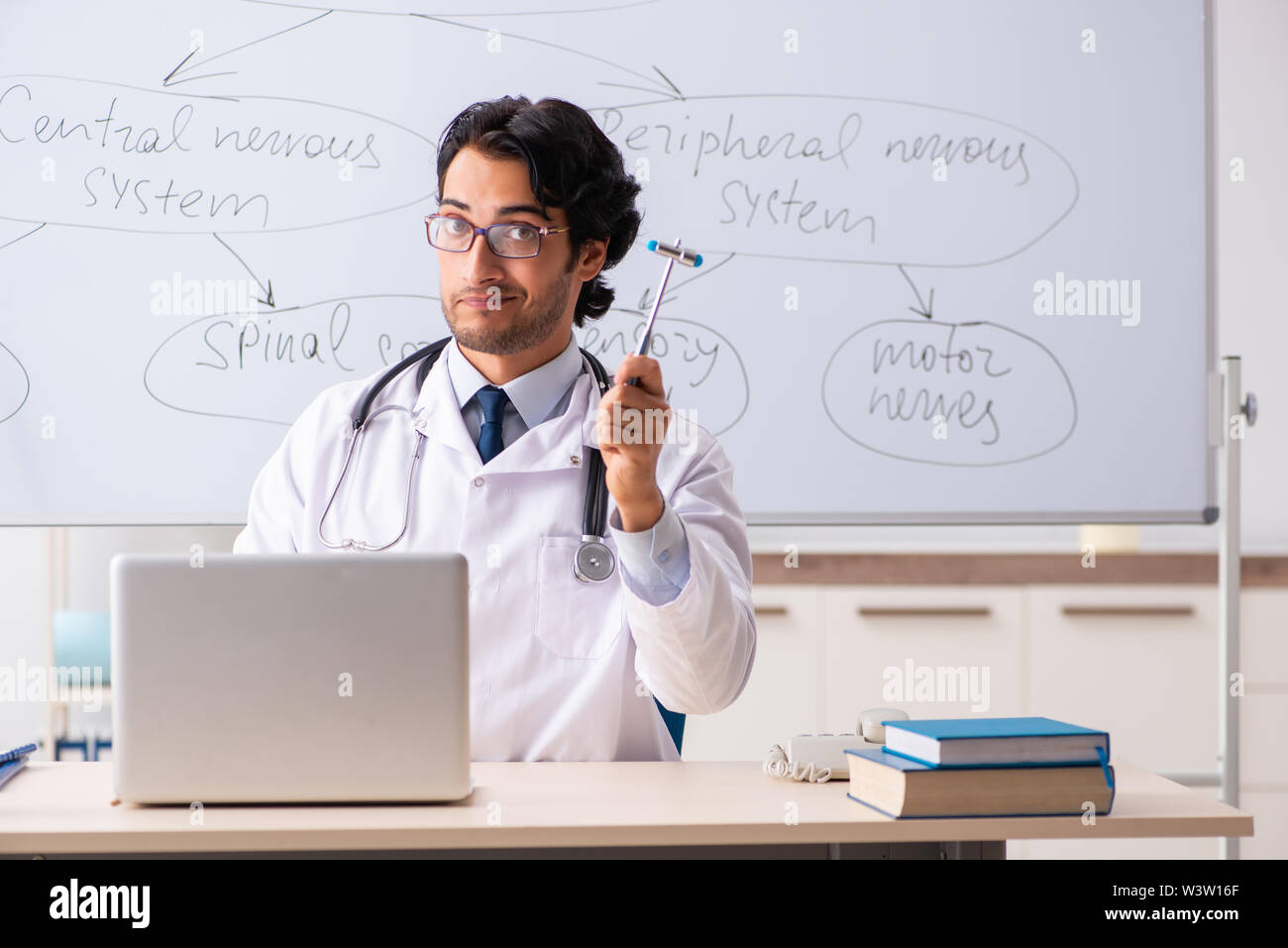 The young male doctor neurologist in front of whiteboard Stock Photo ...