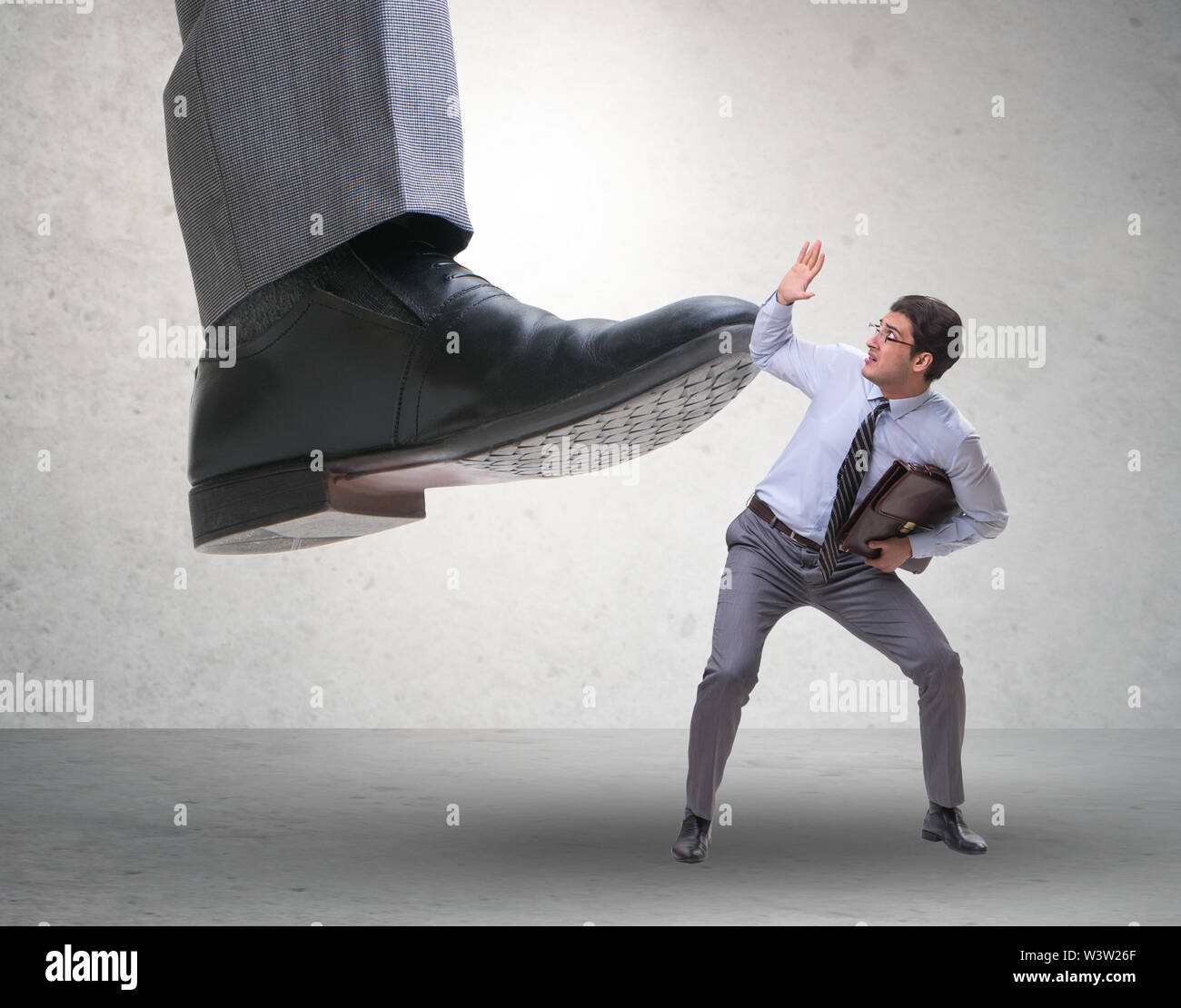 The bad angry boss stamping on employee in business concept Stock Photo ...