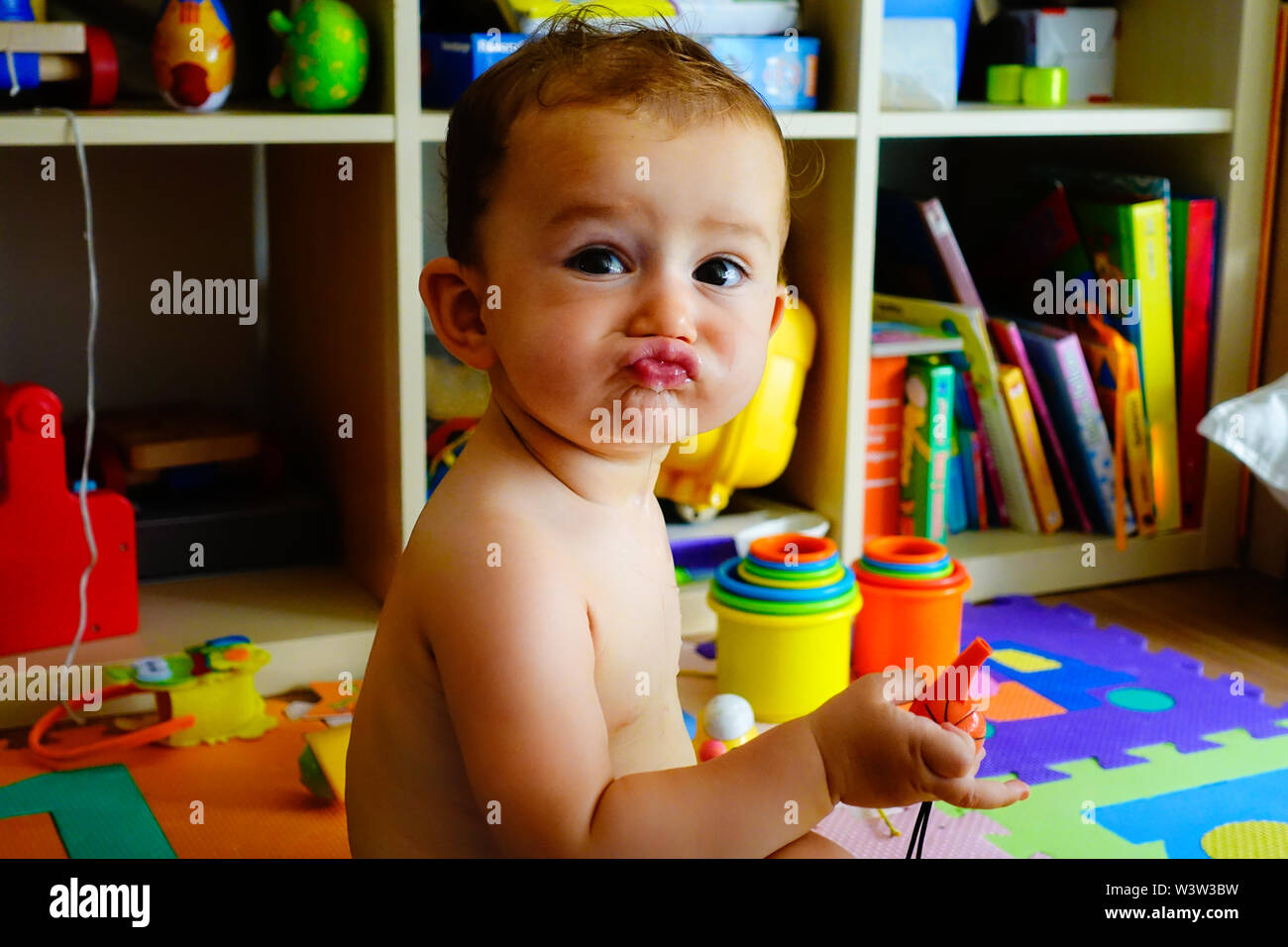 Infant girl making face hi-res stock photography and images - Alamy