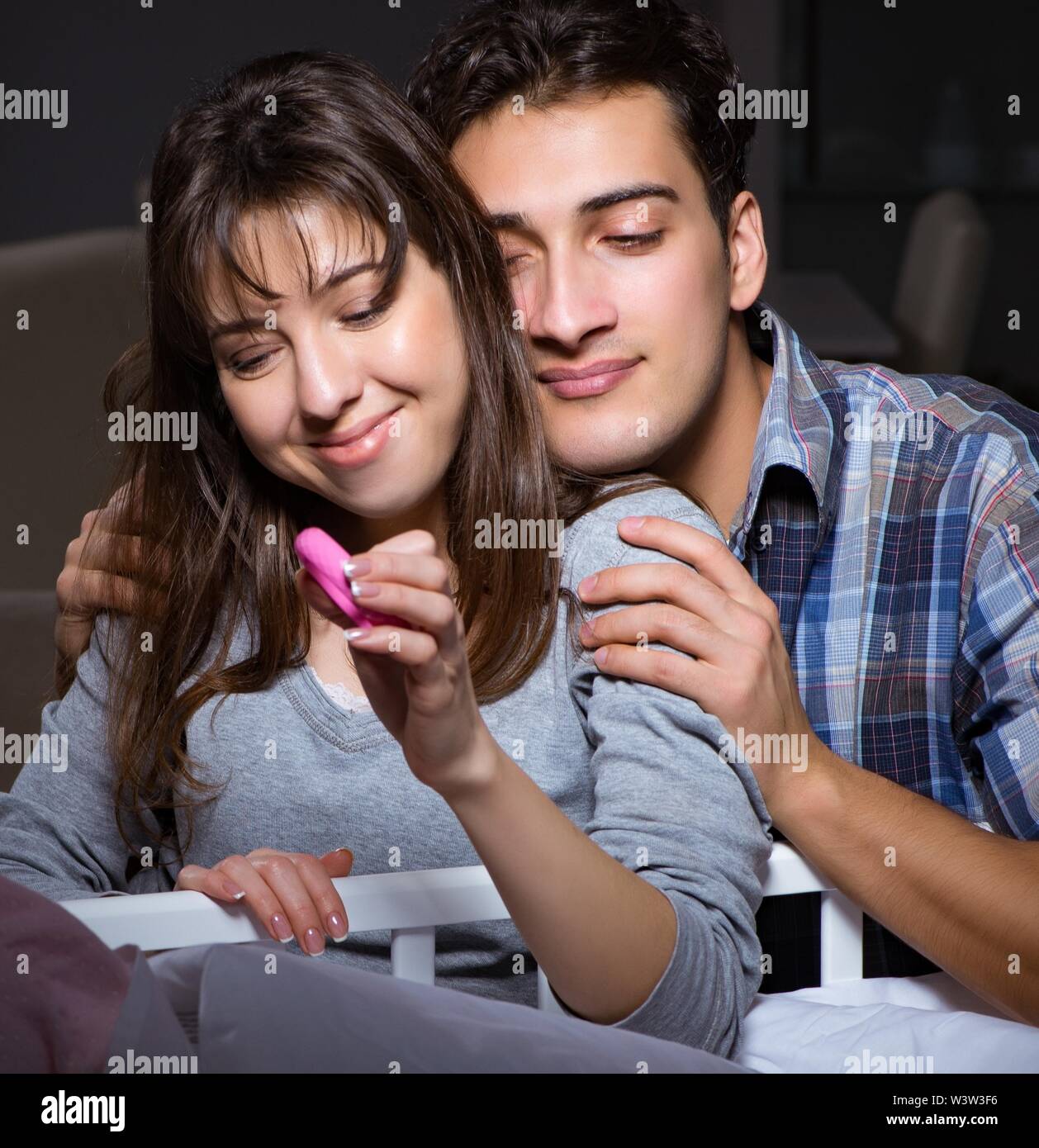The young parents sleepless with newborn baby at night Stock Photo - Alamy