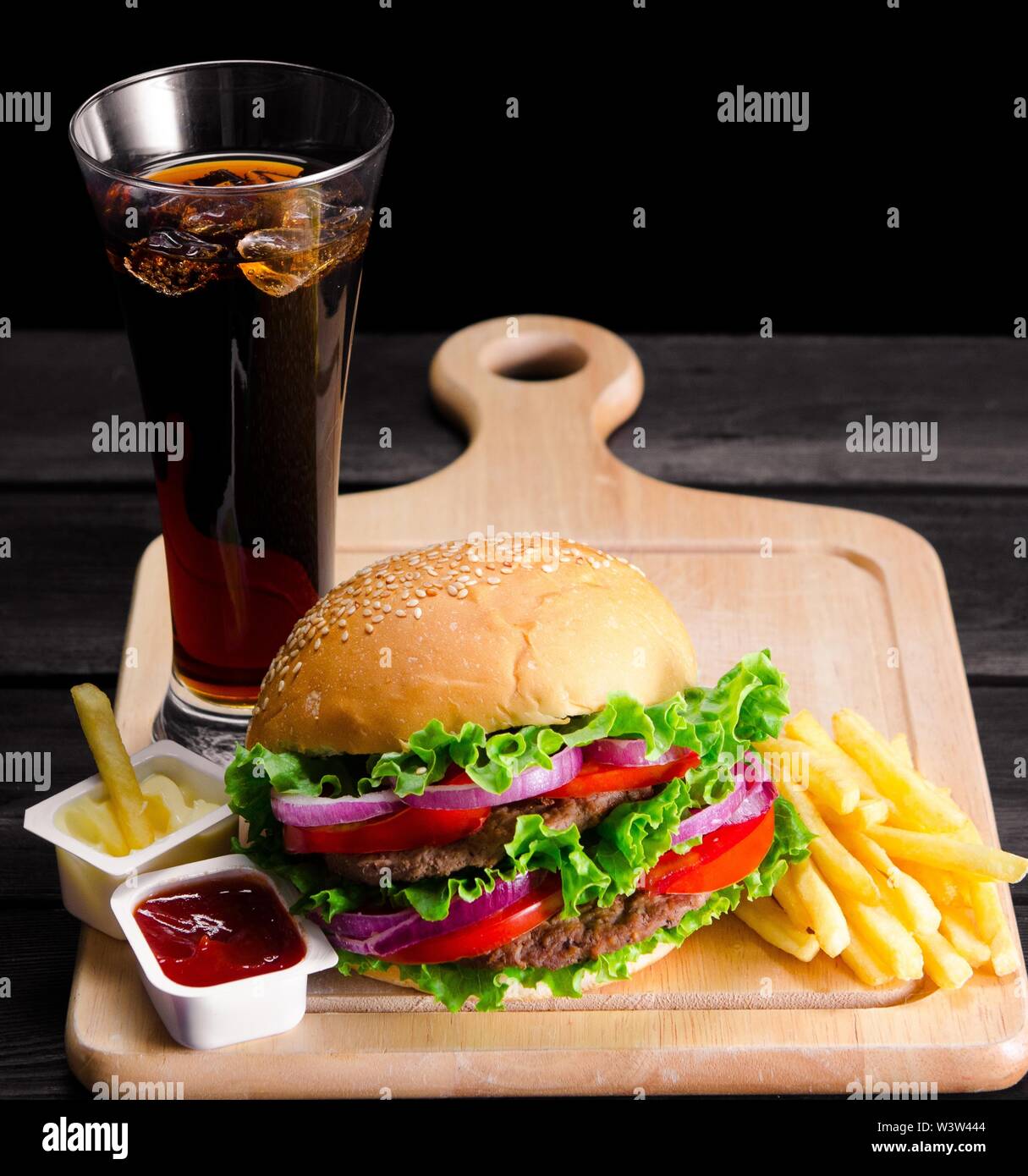 The burger served in bun in nutrition fast food concept Stock Photo - Alamy