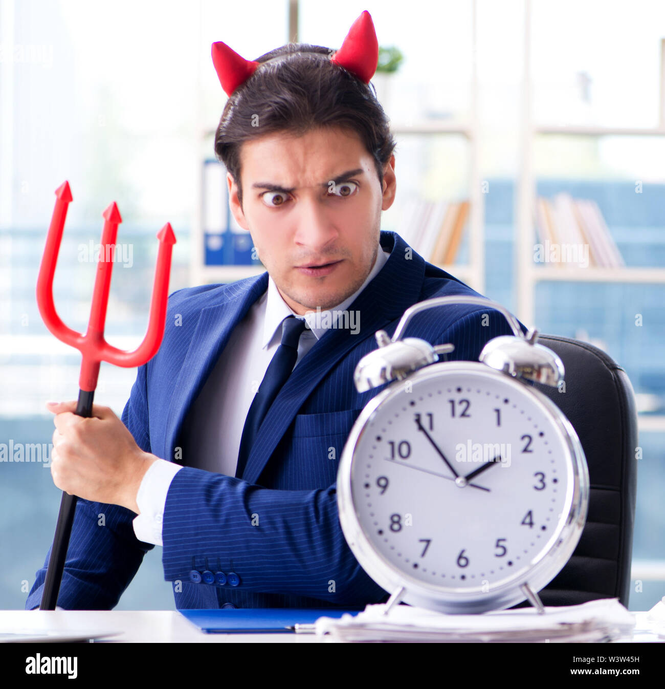 The devil angry businessman in the office Stock Photo - Alamy