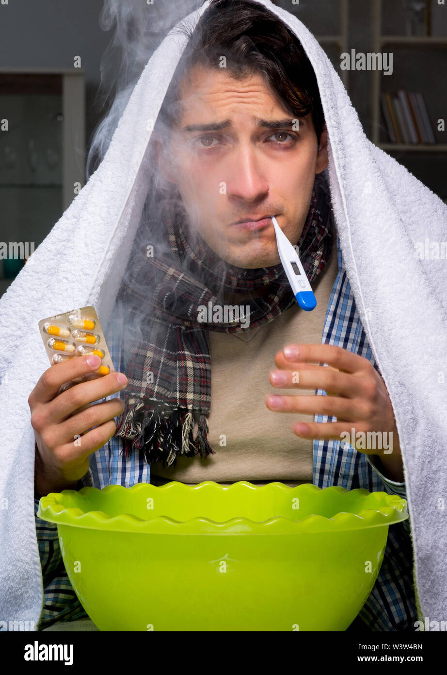 The sick man doing inhalation at night in home Stock Photo - Alamy