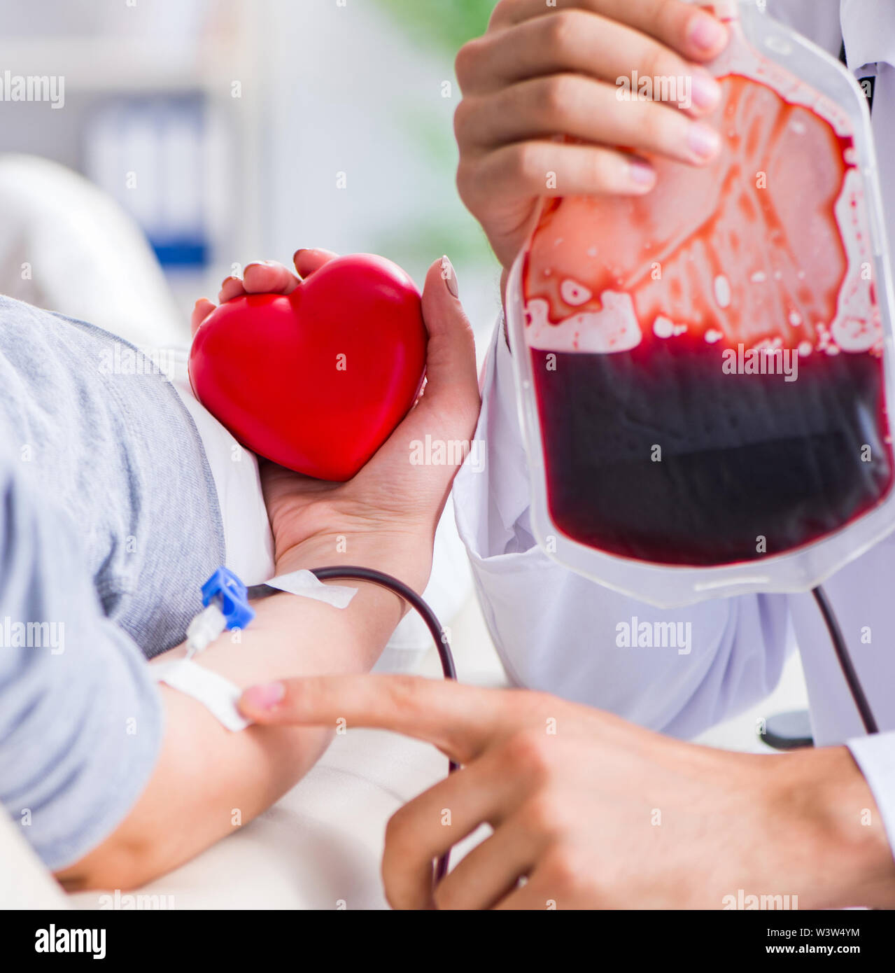 The patient getting blood transfusion in hospital clinic Stock Photo ...