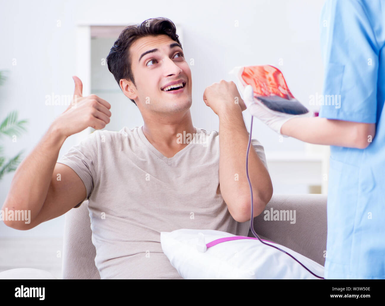 The patient getting blood transfusion in hospital clinic Stock Photo ...