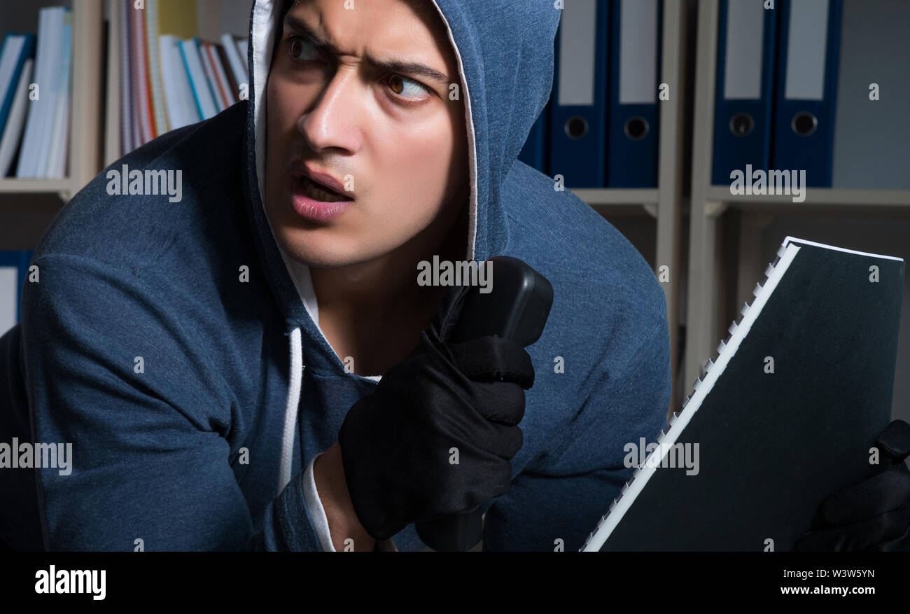 The young man in industrial espionage concept Stock Photo - Alamy