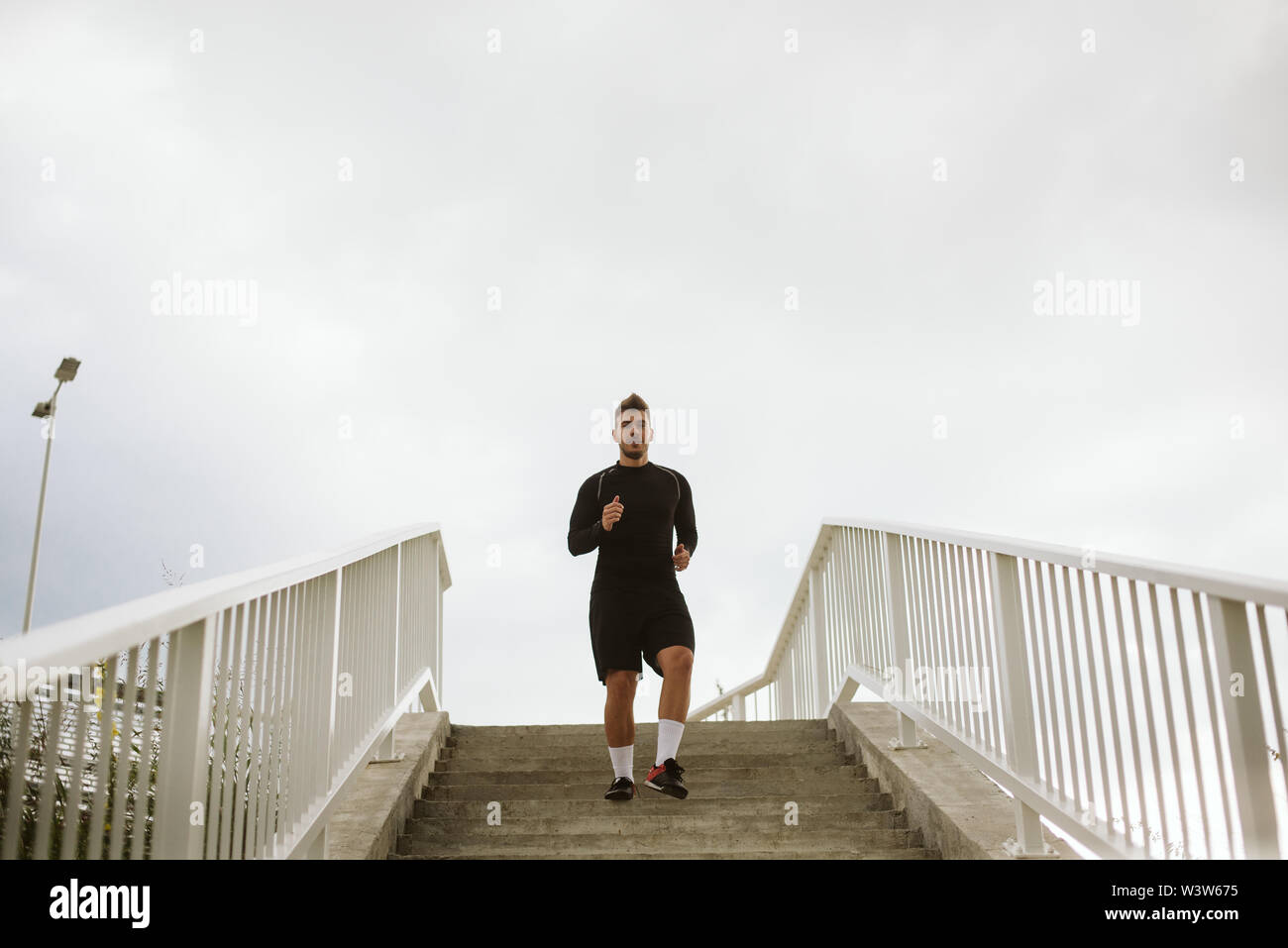 Athletic Man Doing Running Exercise Stock Photo - Alamy