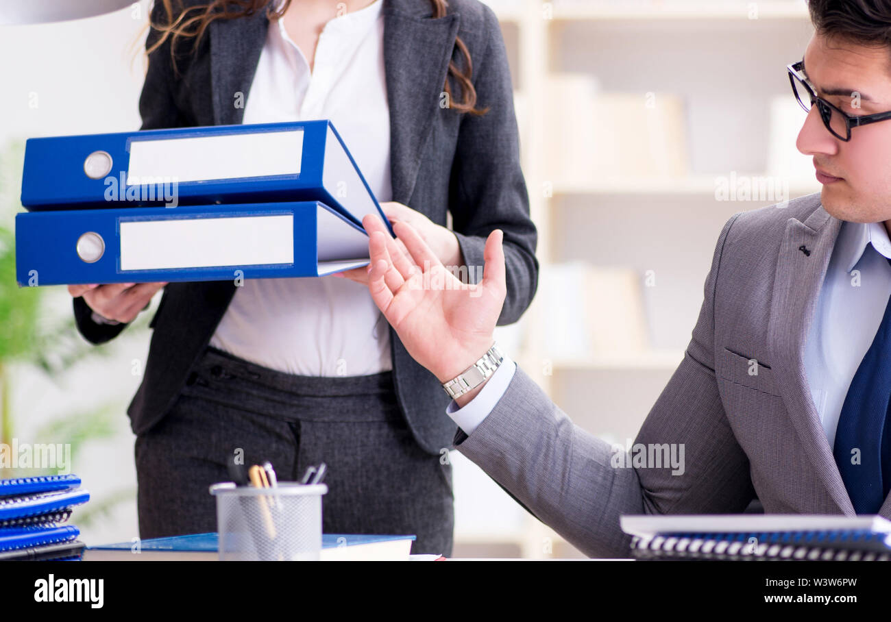 The businessman asking for paperwork from his assistant secretary Stock ...