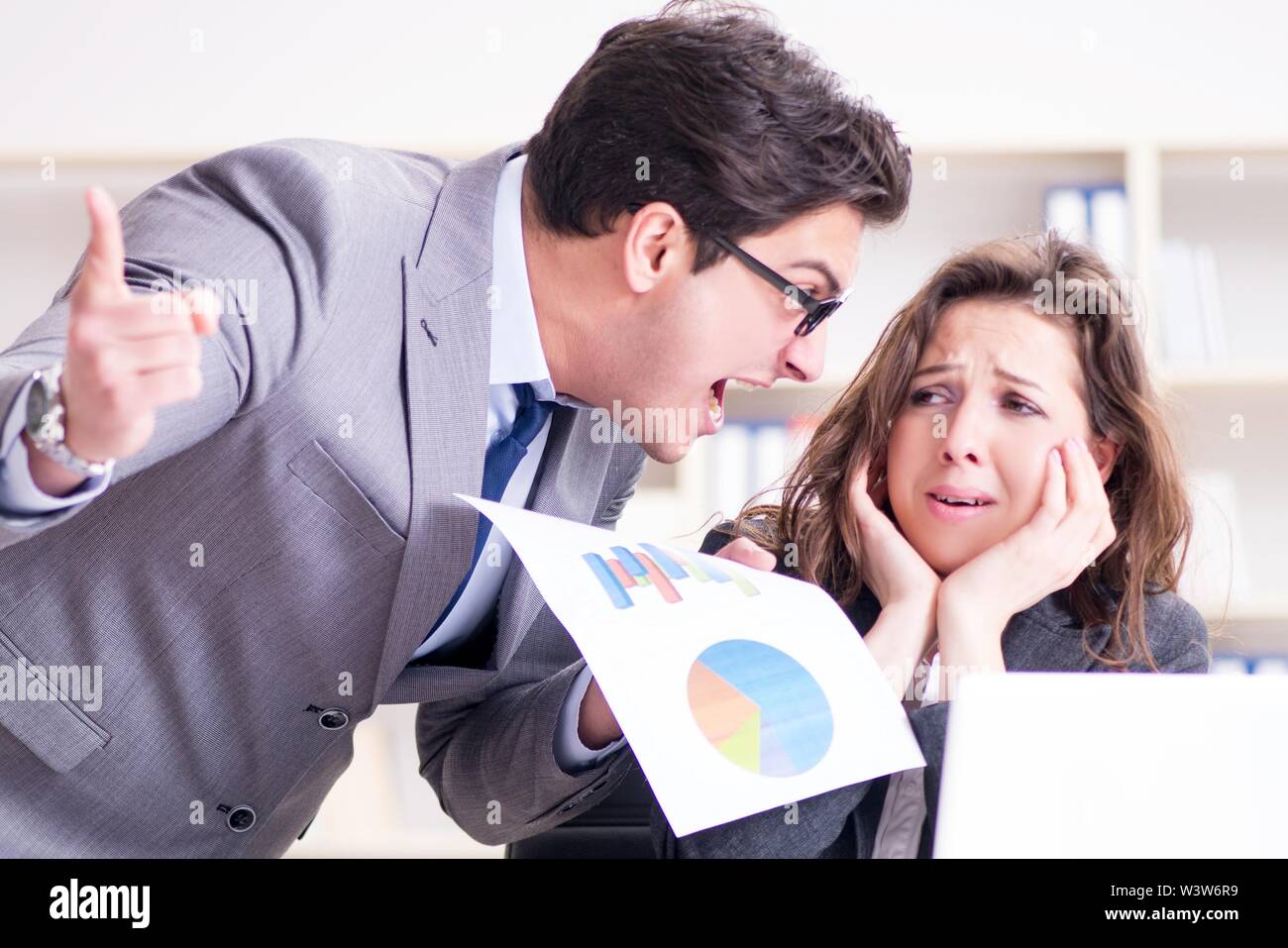 The angry boss unhappy with female employee performance Stock Photo - Alamy