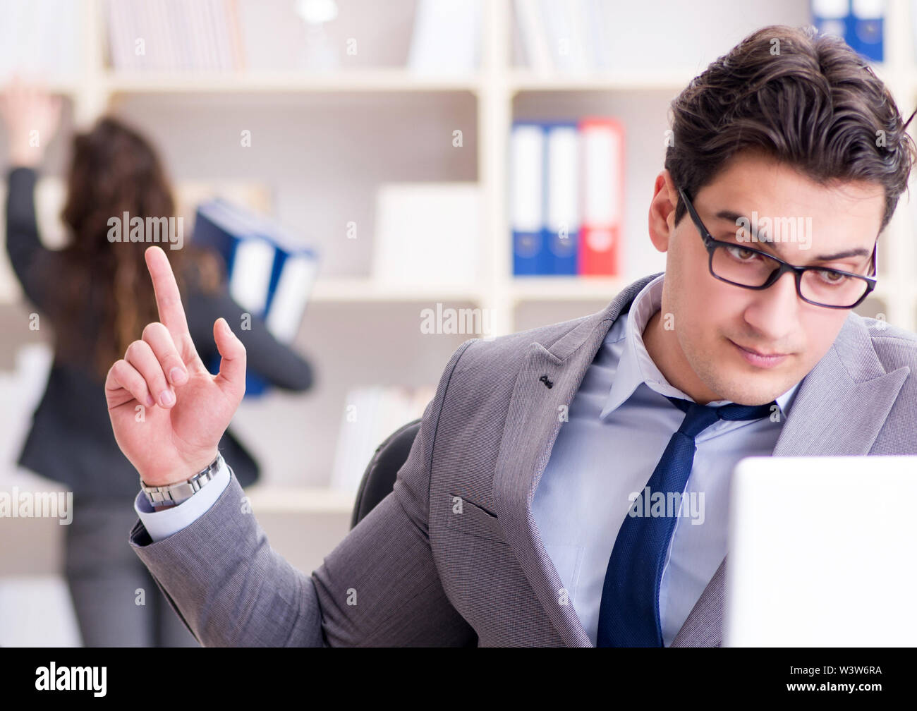 The businessman asking for paperwork from his assistant secretary Stock ...