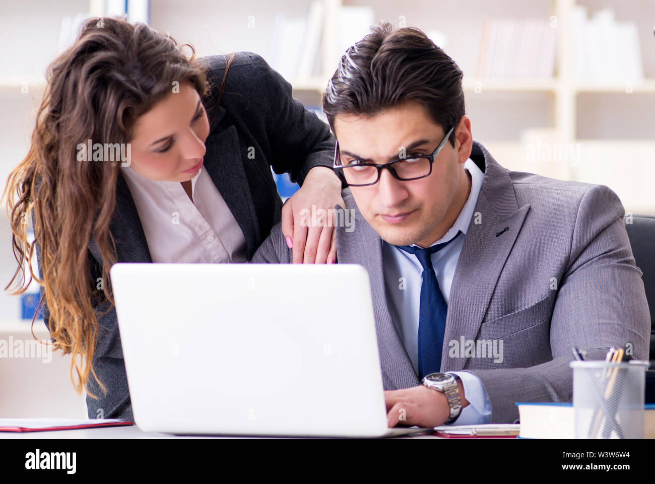 The unhappy boss having a chat with his secretary Stock Photo - Alamy