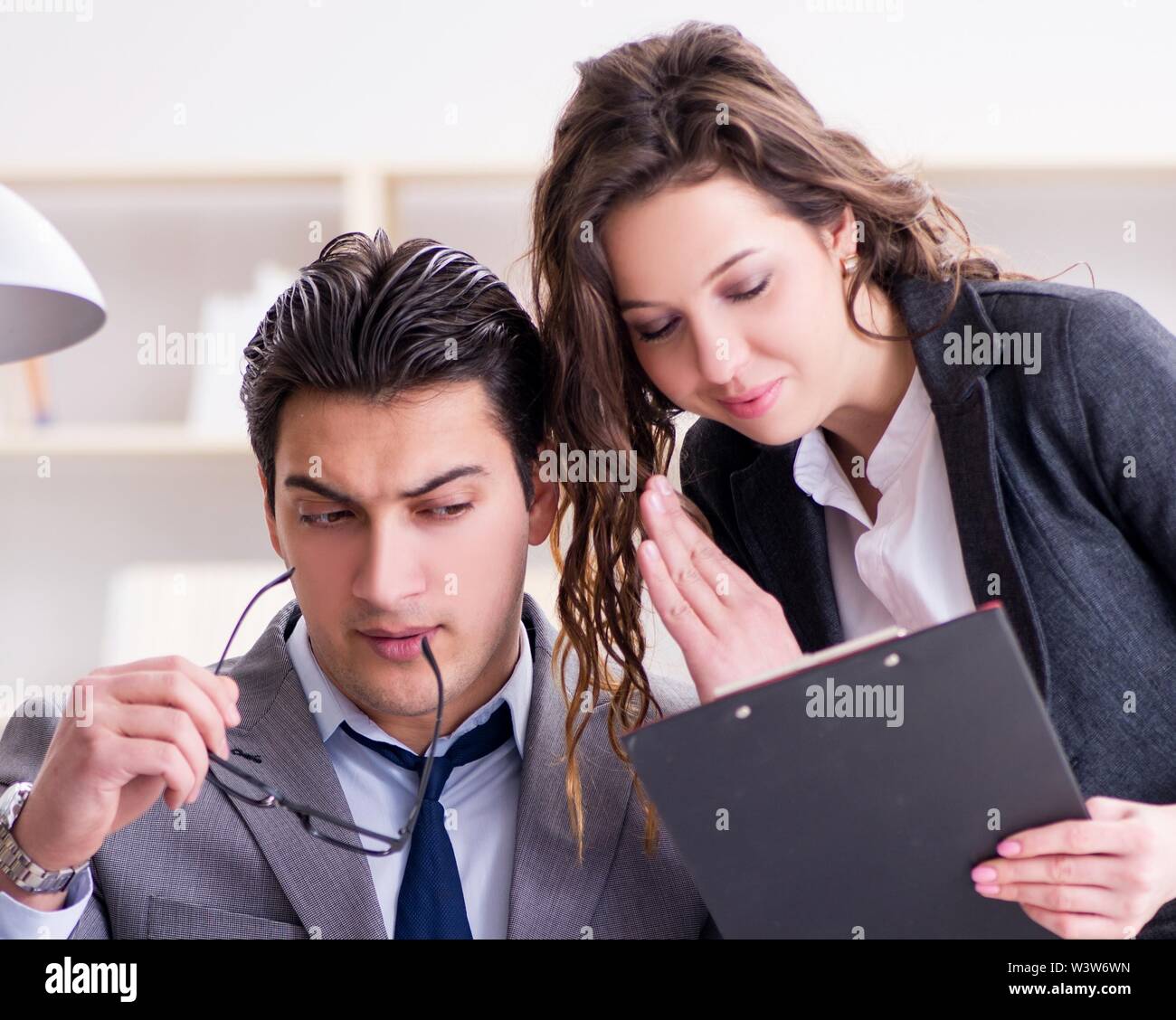 The unhappy boss having a chat with his secretary Stock Photo - Alamy