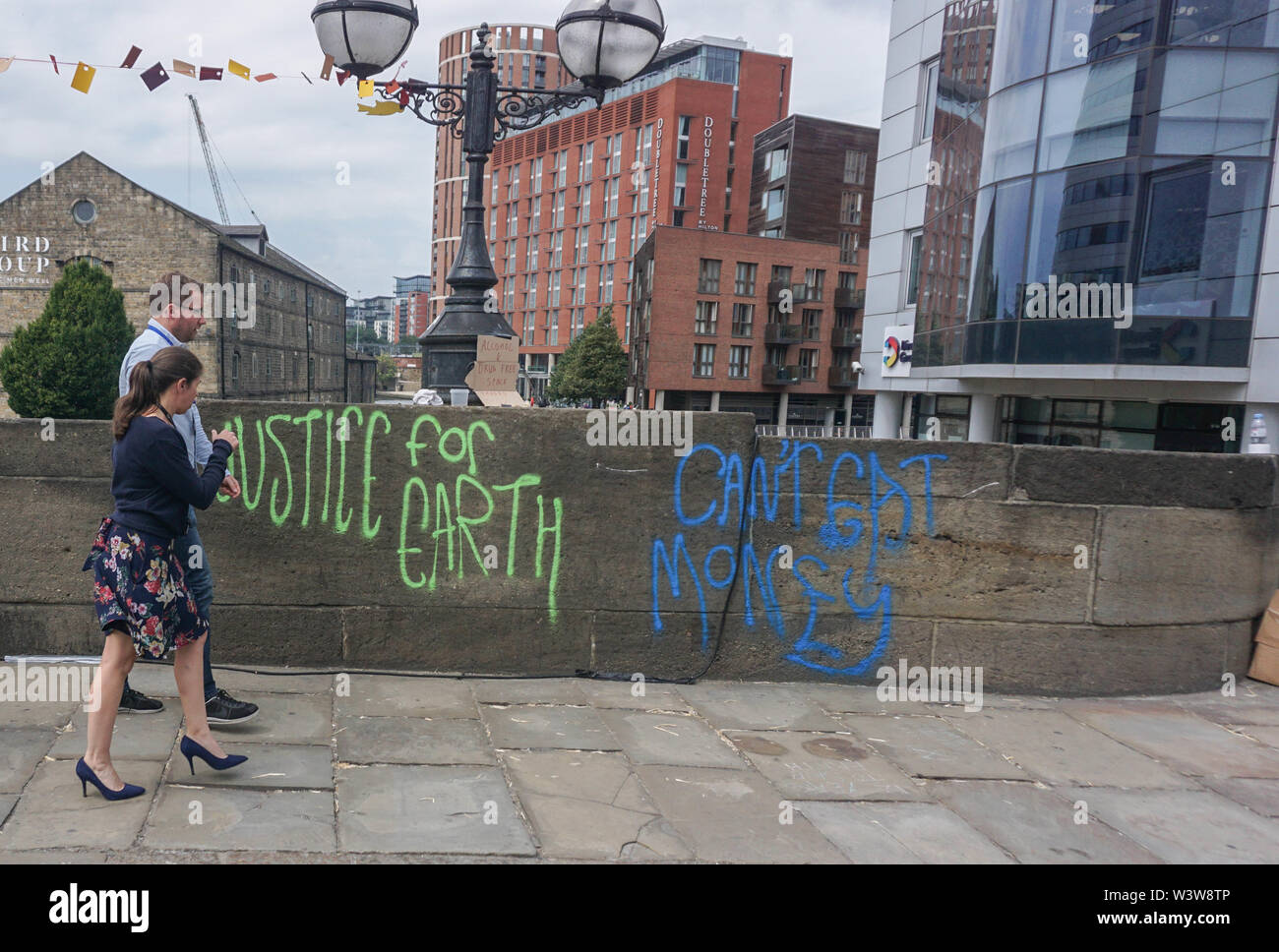 City workers walk pasted a climate message during the protest.Activists ...