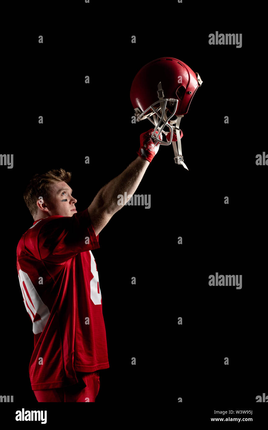 American football player cheering with arm up Stock Photo - Alamy