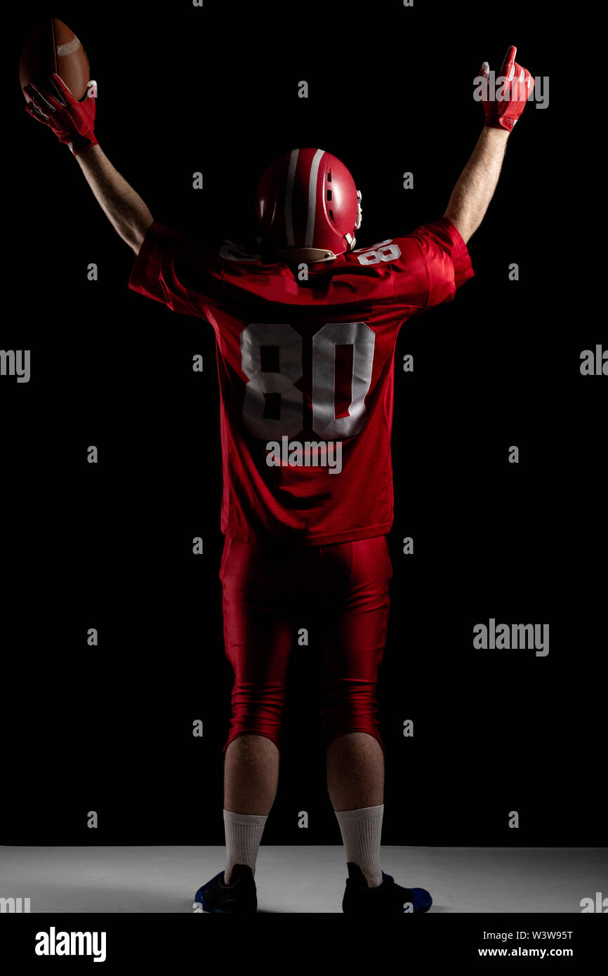 American football player cheering with arms up Stock Photo - Alamy