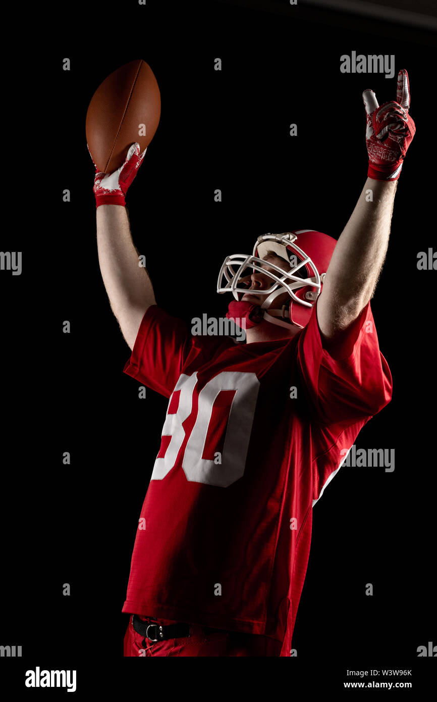 American football player cheering with arms up Stock Photo - Alamy