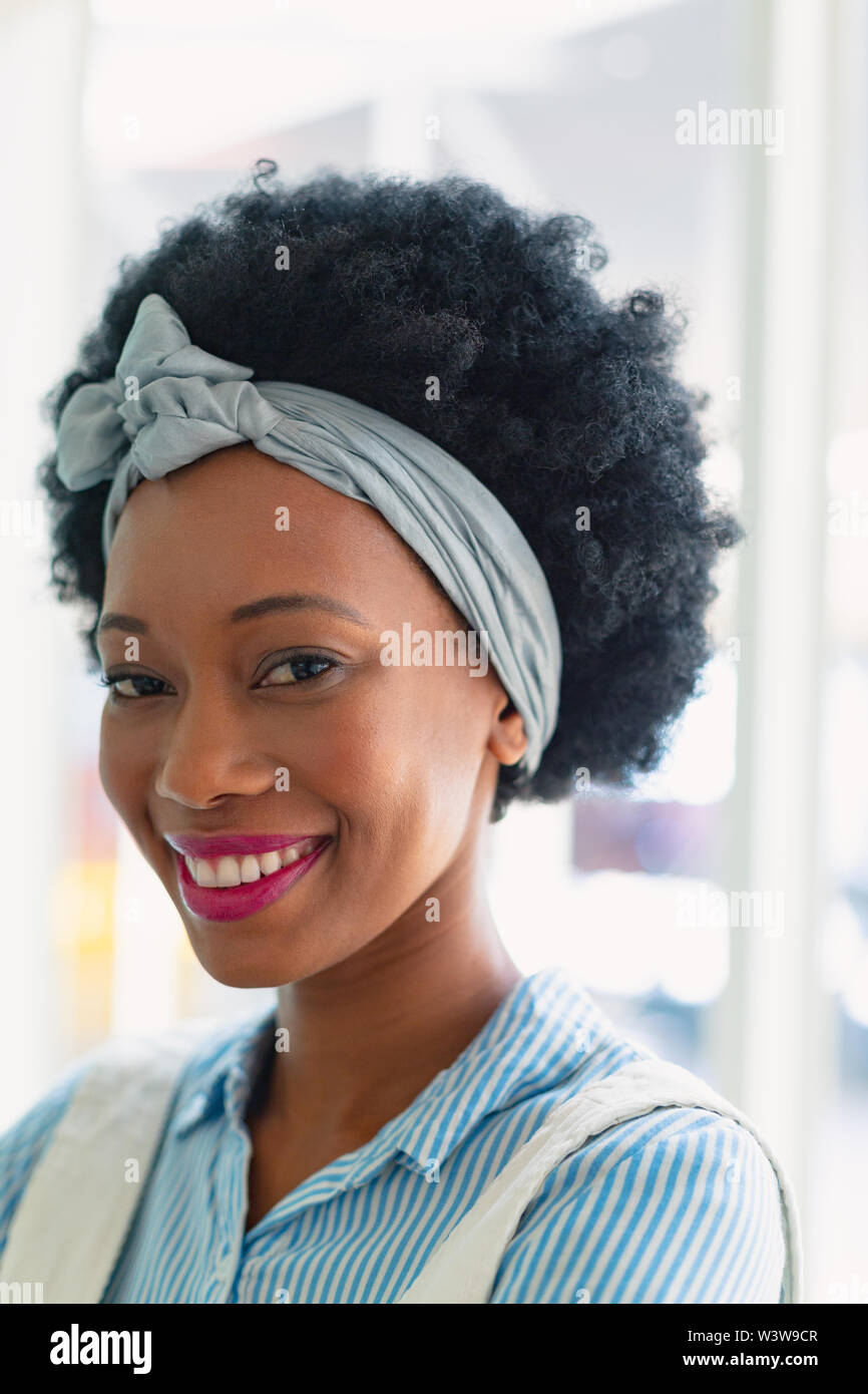 Female graphic designer smiling in office Stock Photo - Alamy