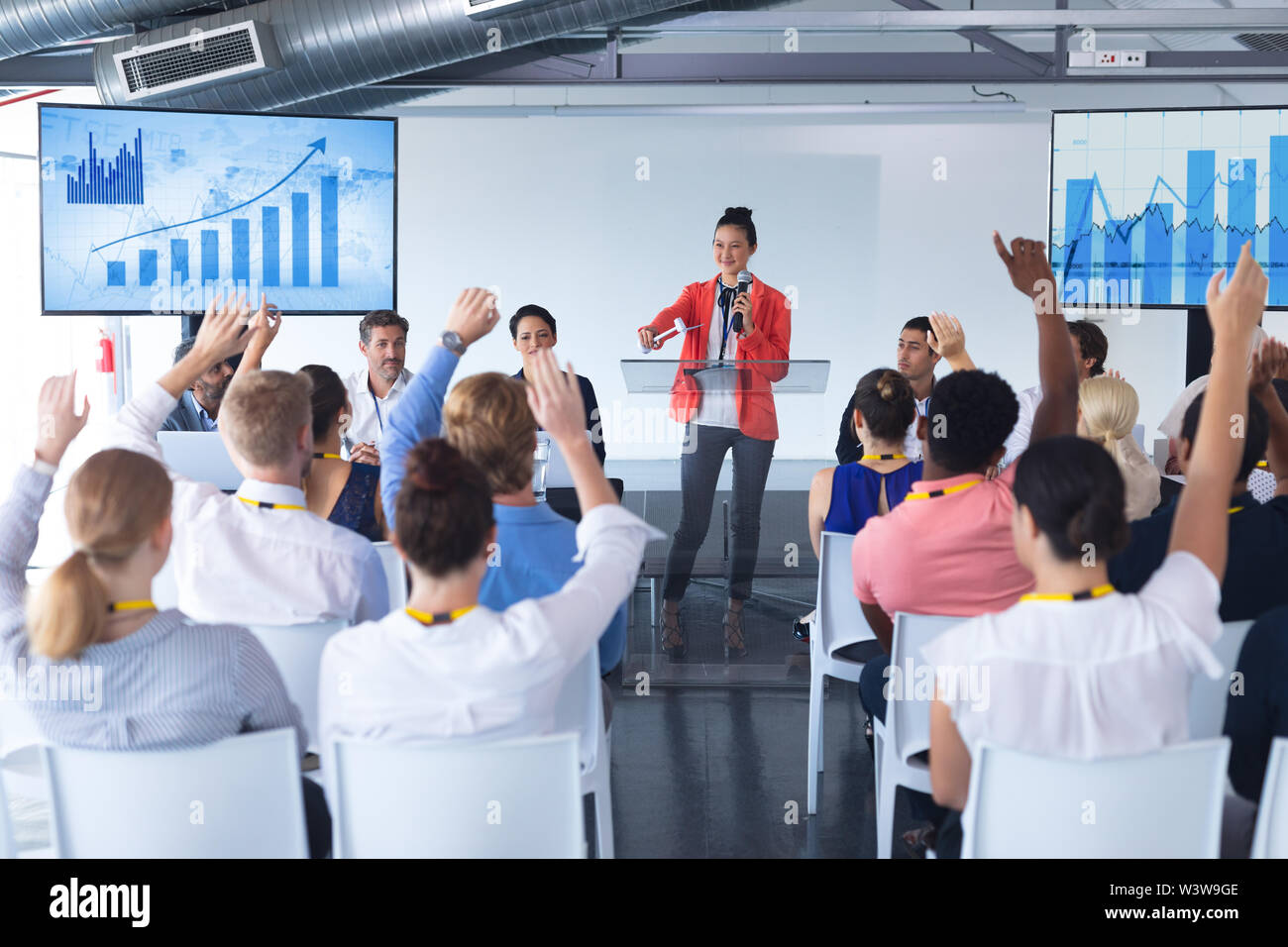 Business people raising their hands in a business conference Stock ...