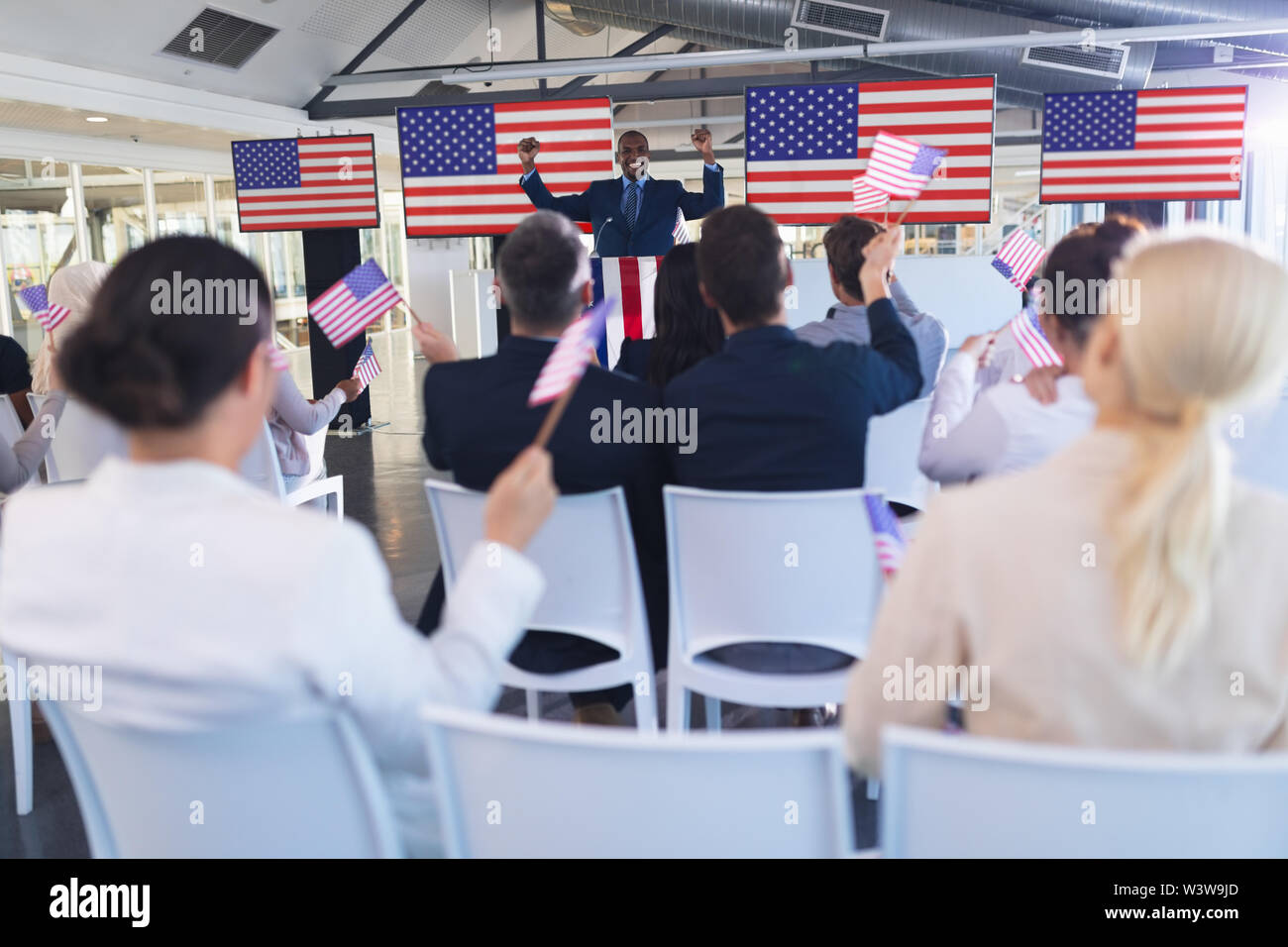 Business people waving an American flag in business seminar Stock Photo ...