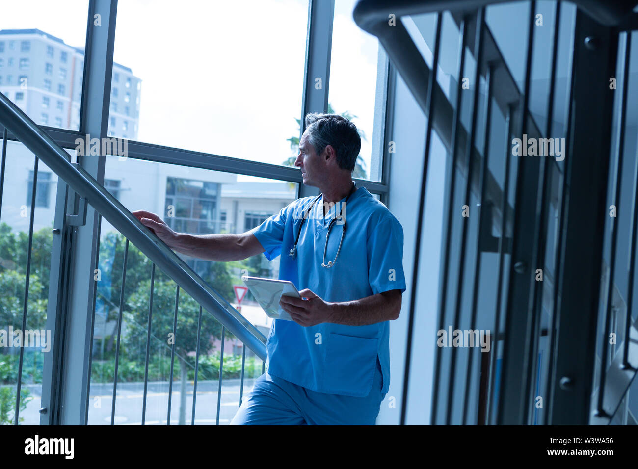 Man going upstairs hi-res stock photography and images - Alamy