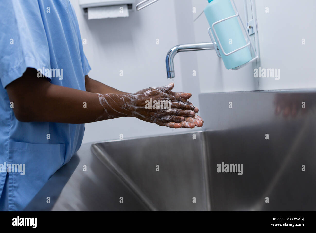 Male surgeon washing hands in sink at hospital Stock Photo - Alamy
