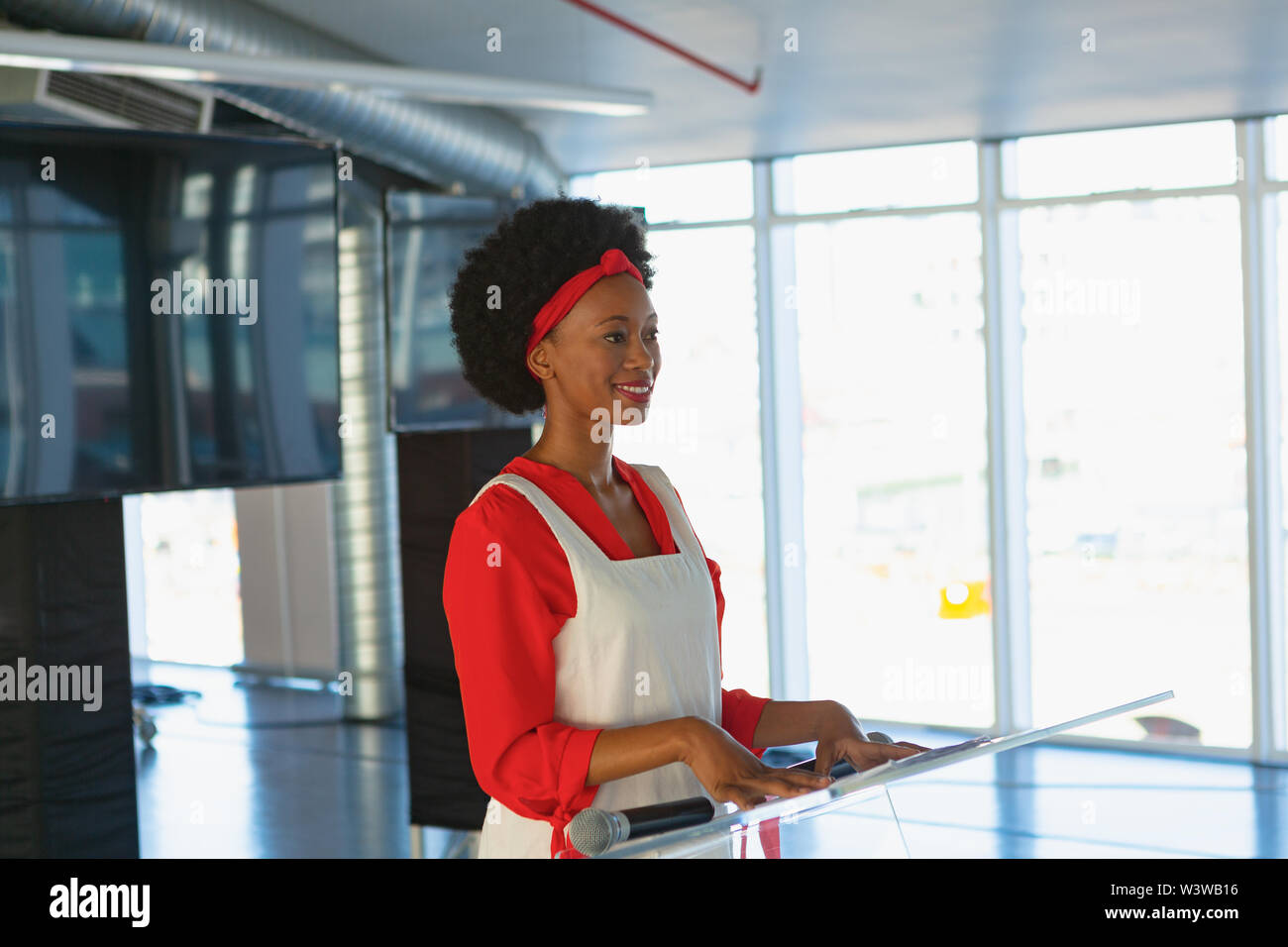 Female executive practicing her speech in the conference room at office ...