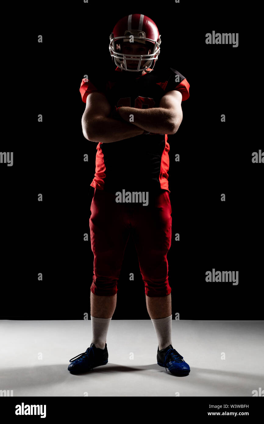 American football player in helmet standing with arms crossed Stock ...