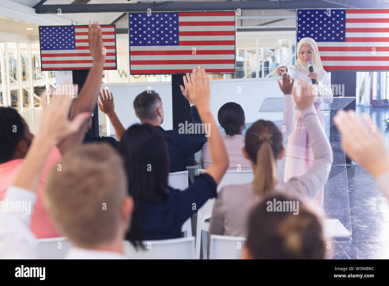 Women raising hands conference hi-res stock photography and images - Alamy