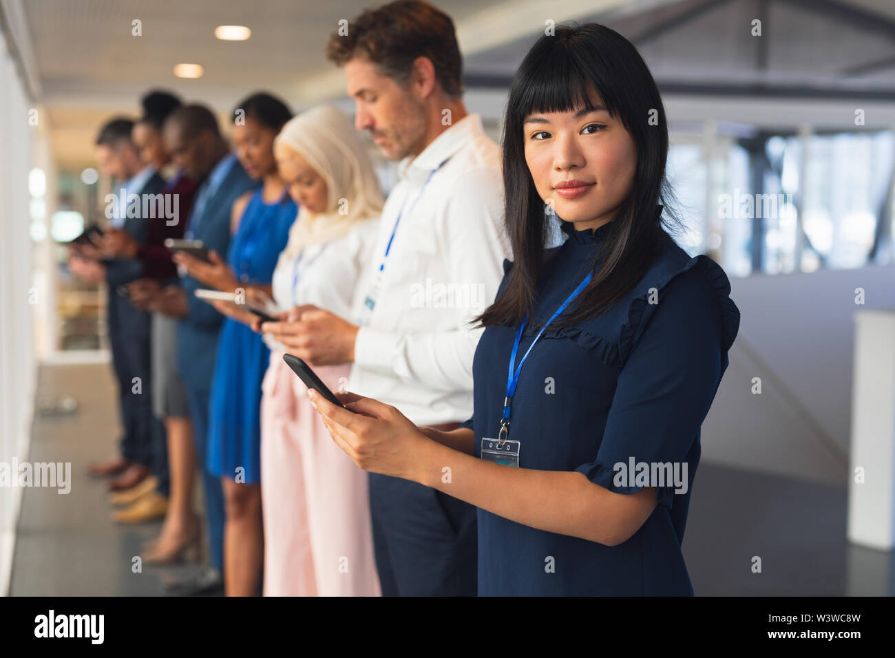 Business people using multimedia devices in business seminar Stock ...