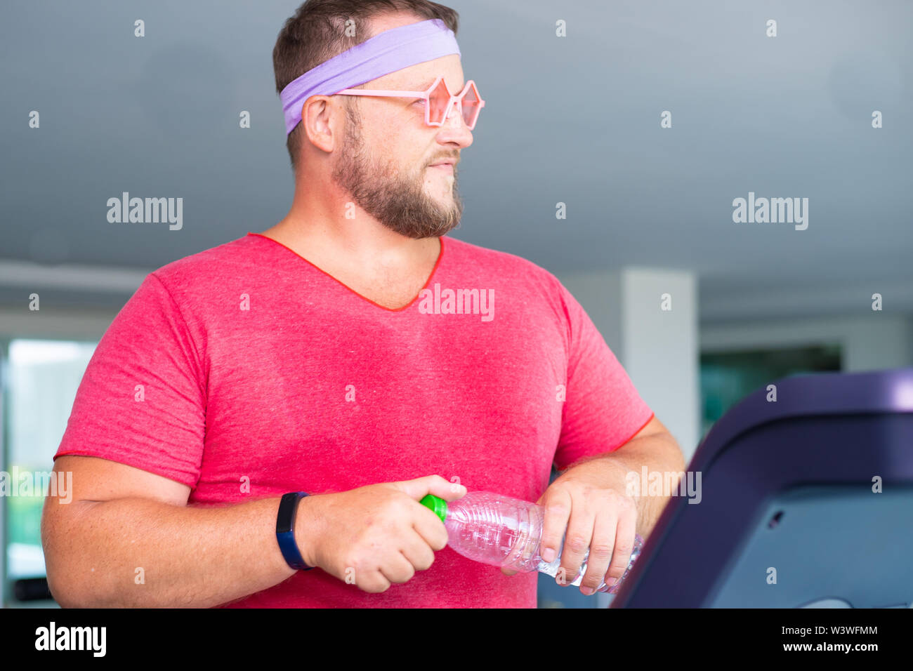 Fat man on treadmill hi-res stock photography and images - Alamy