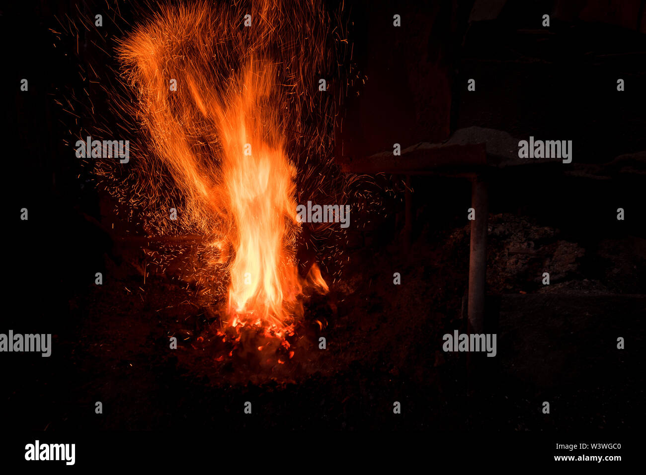 Traditional blacksmith furnace with burning fire Burning fire in ...