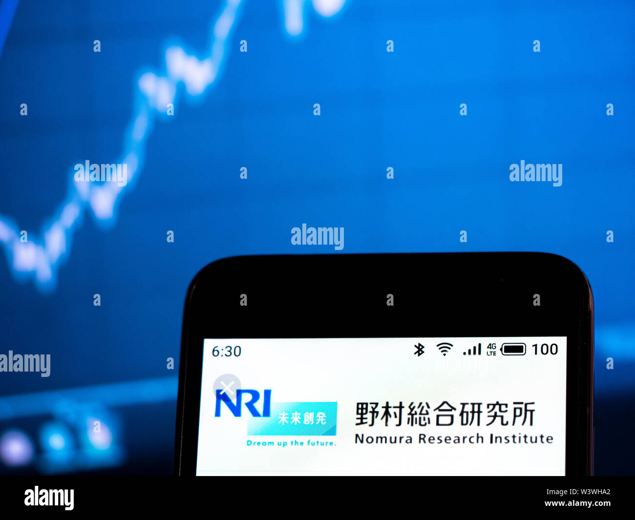 In this photo illustration the Nomura Research Institute, Ltd. logo is ...