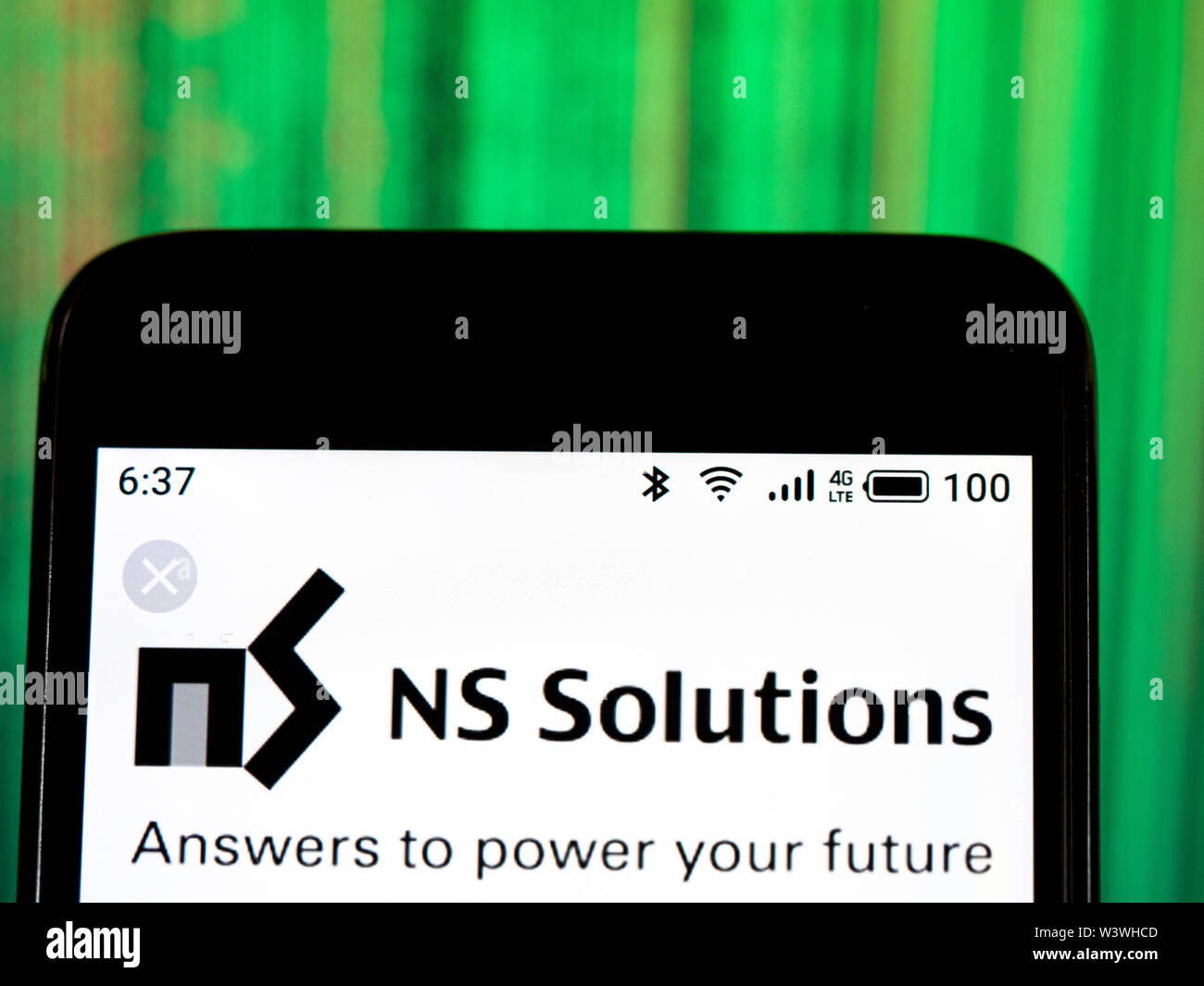 In this photo illustration the NS Solutions Corp. logo is seen ...