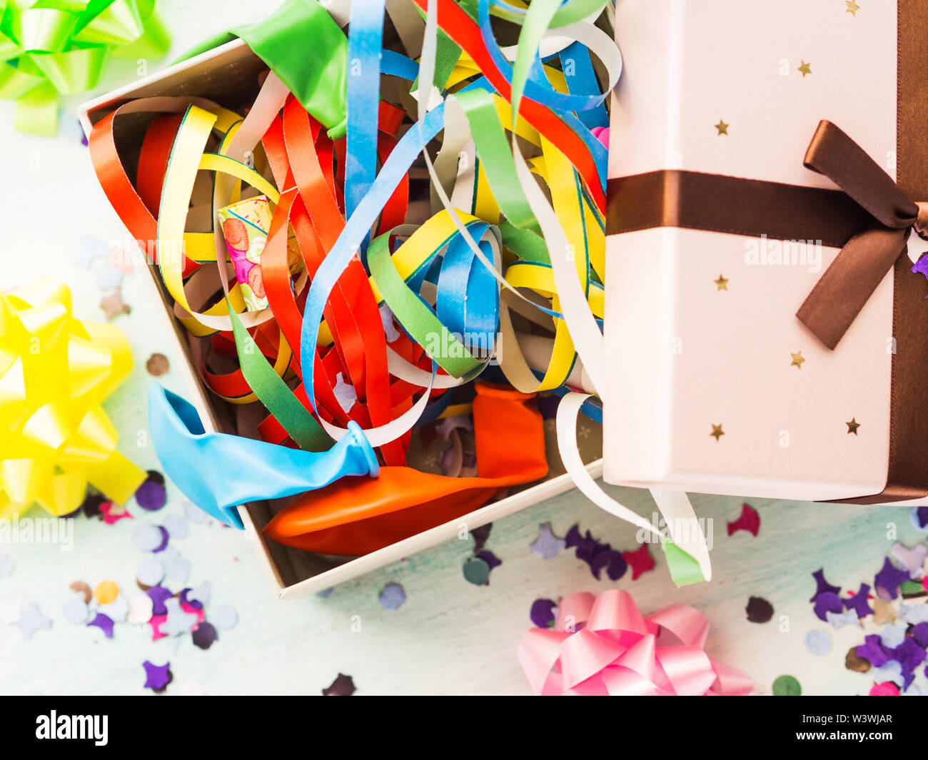 Open gift box with streamers, confetti. Party concept Stock Photo - Alamy