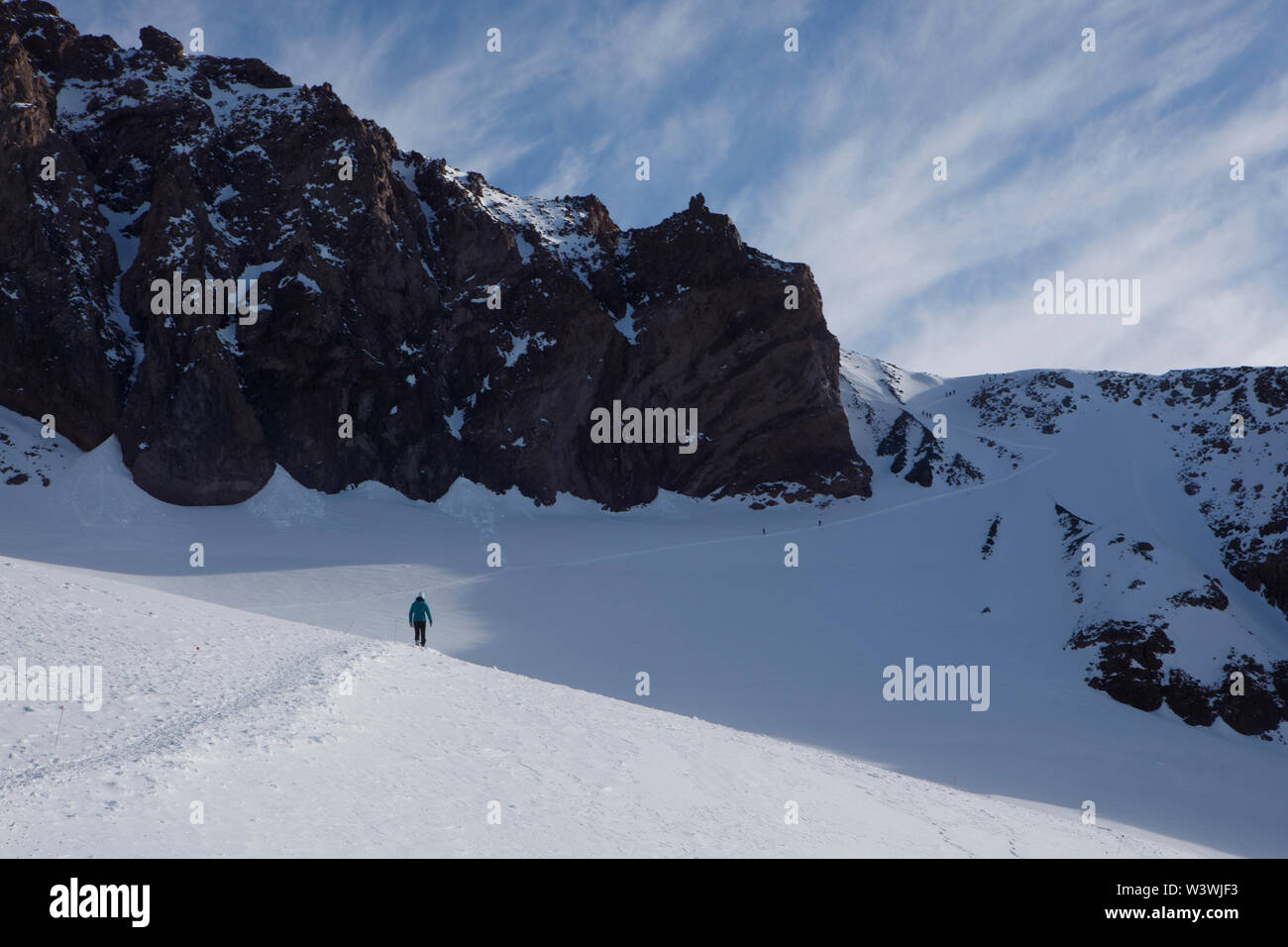 A Climber Ascends A Trail Above Camp Muir on Mount Rainier Stock Photo ...