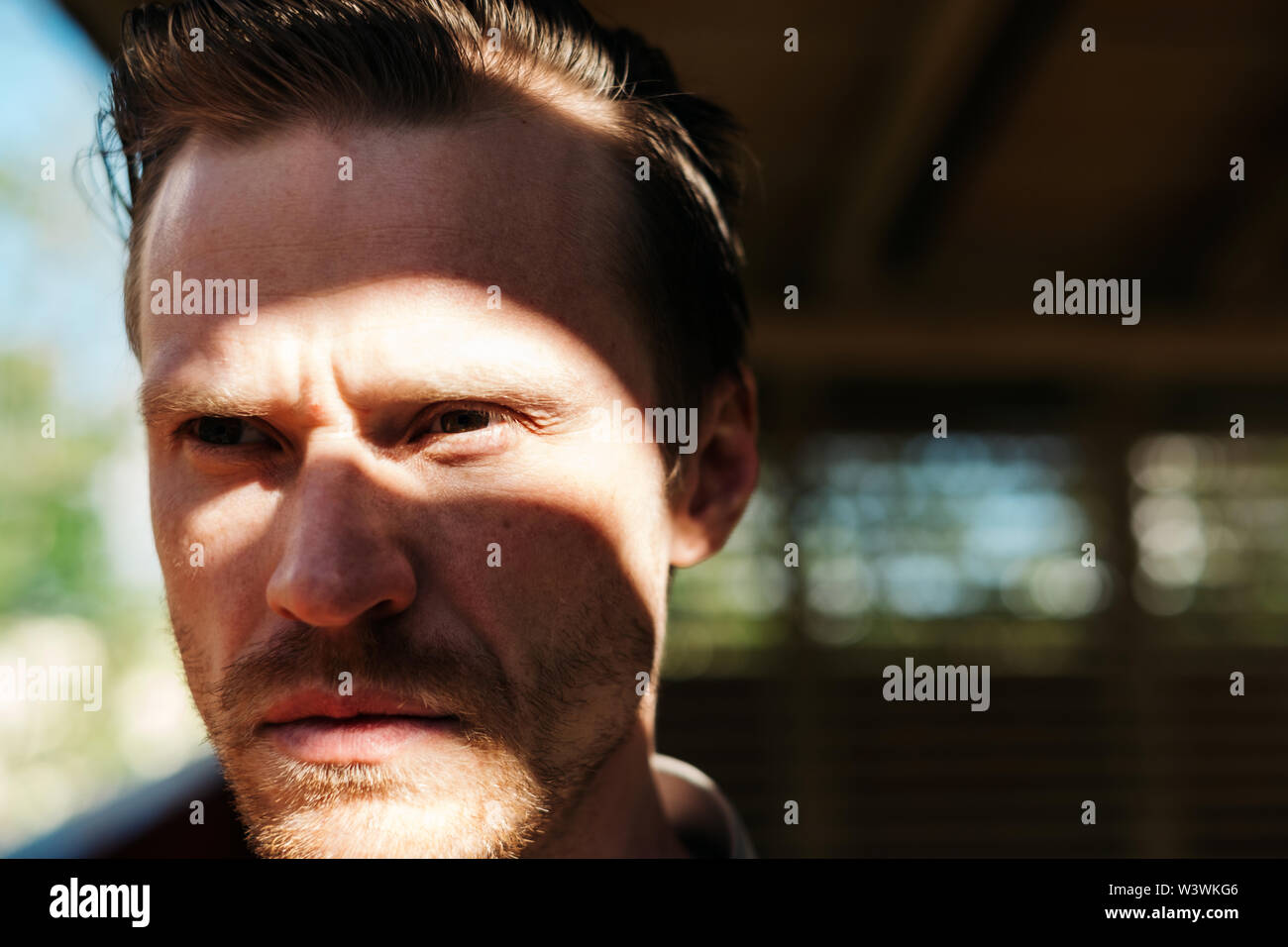 Portrait Of Young Attractive Man In Contrast Light Stock Photo - Alamy
