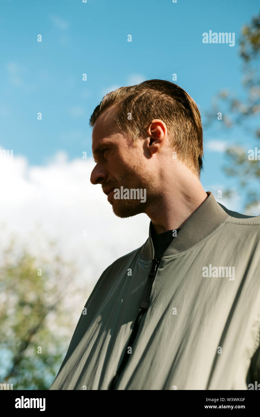 Portrait Of Young Attractive Man on sky background Stock Photo - Alamy Portrait Of Young Attractive Man on sky background Stock Photo - Alamy