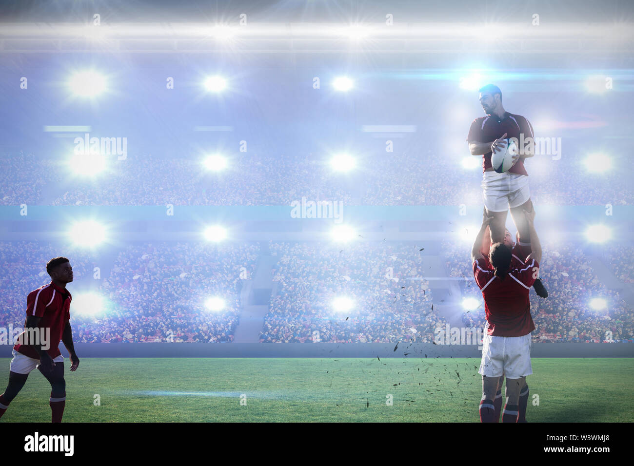 Composite image of rugby player catching the ball in the air Stock ...