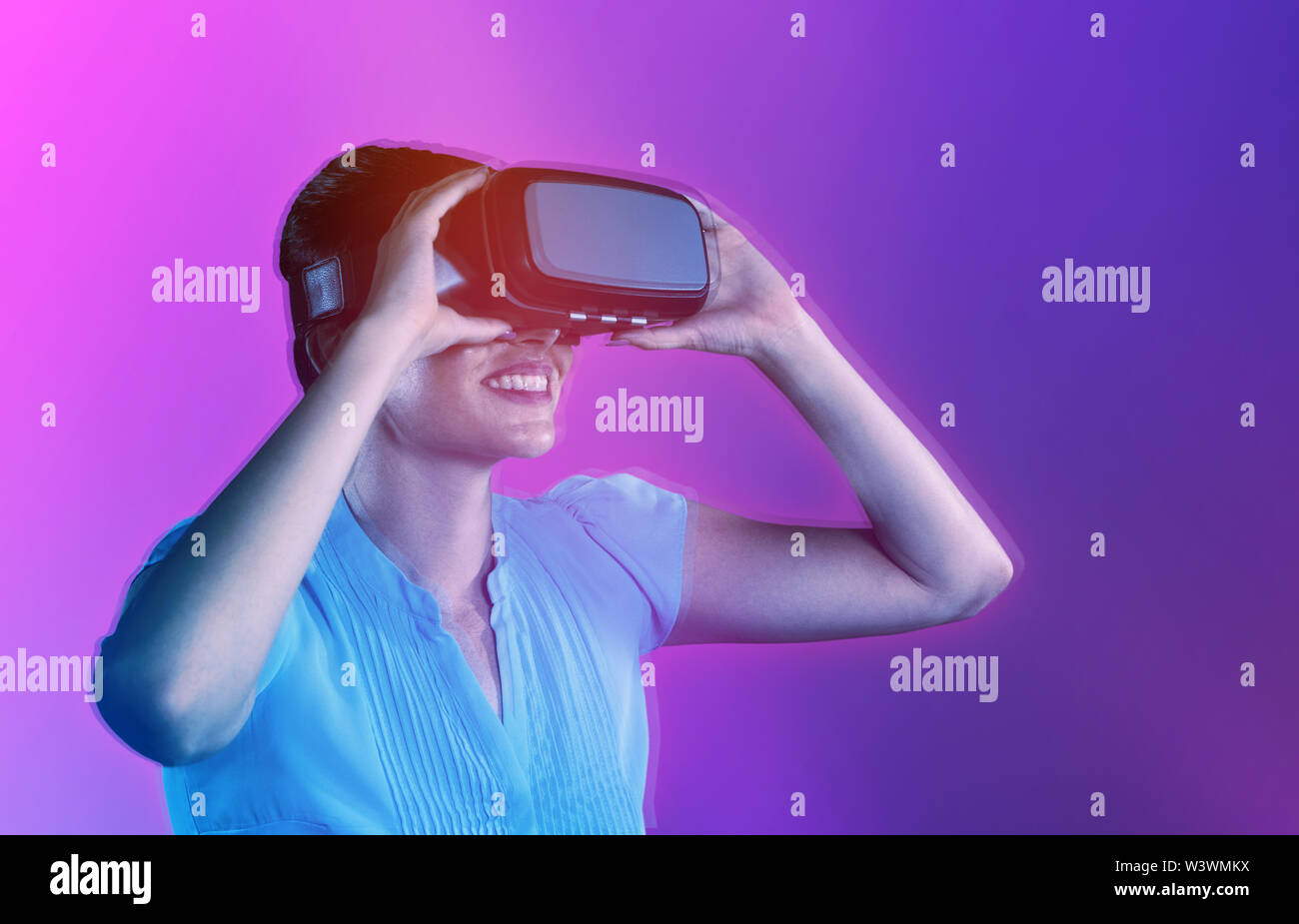 Composite image of female use virtual reality headset Stock Photo - Alamy