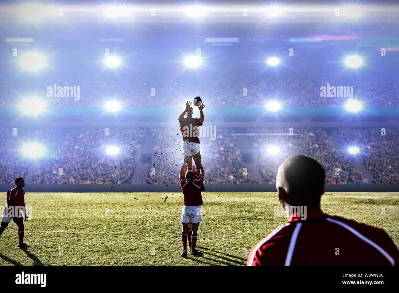 Composite image of rugby player catching the ball in the air Stock ...