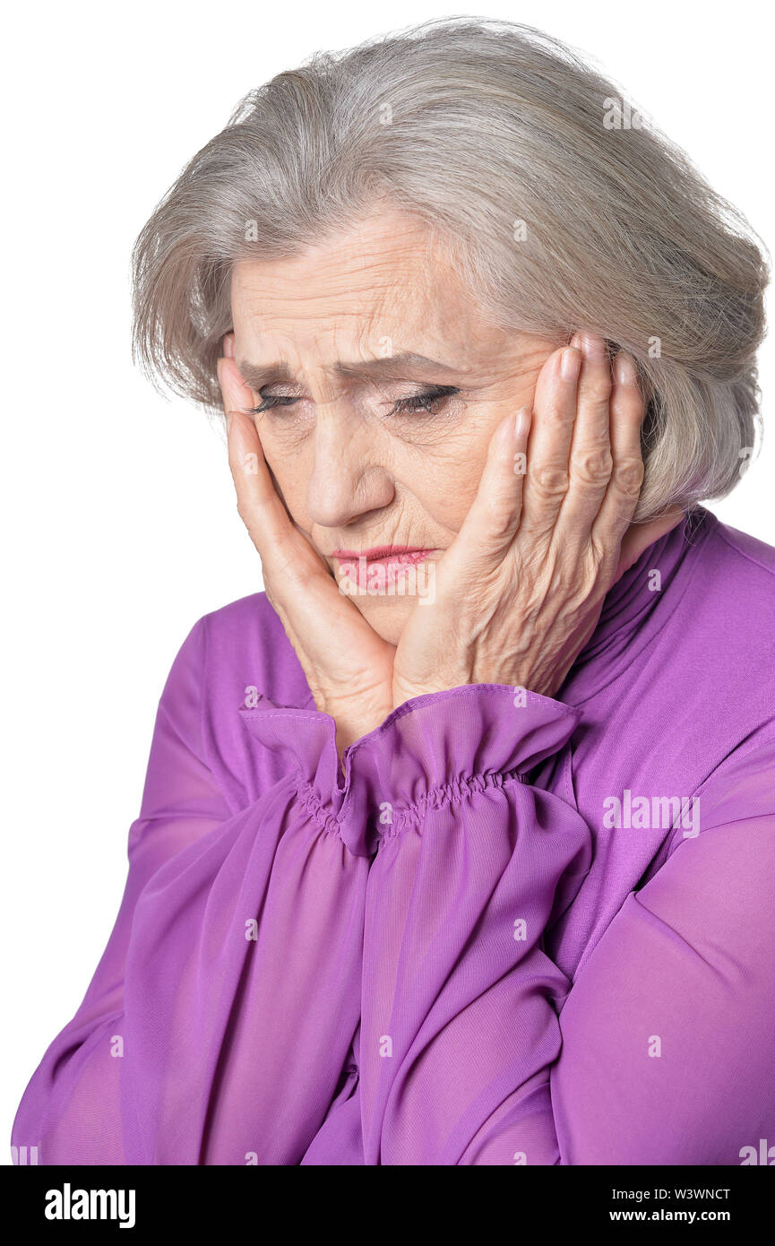 Portrait of sad senior woman posing isolated Stock Photo - Alamy