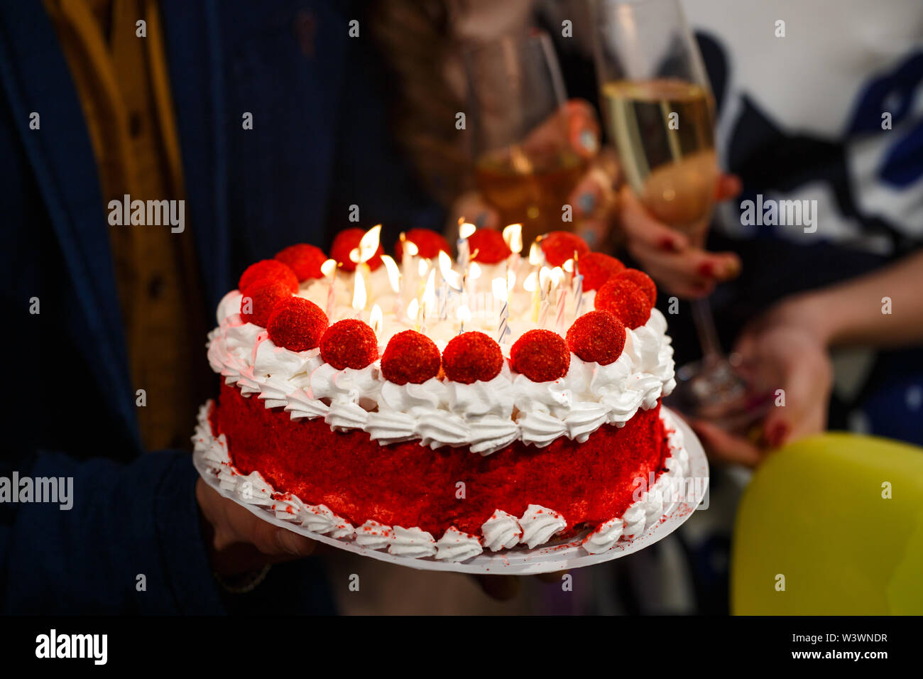 Happy birthday. A group people holding cake Stock Photo - Alamy