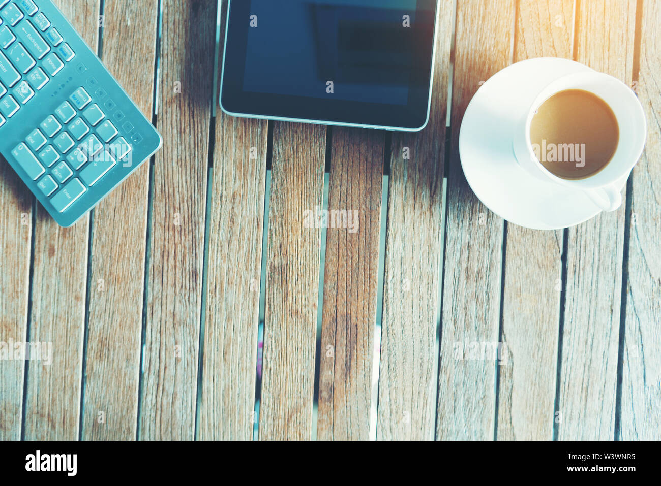 Black tablet ipad on table desk with coffee cup Stock Photo - Alamy
