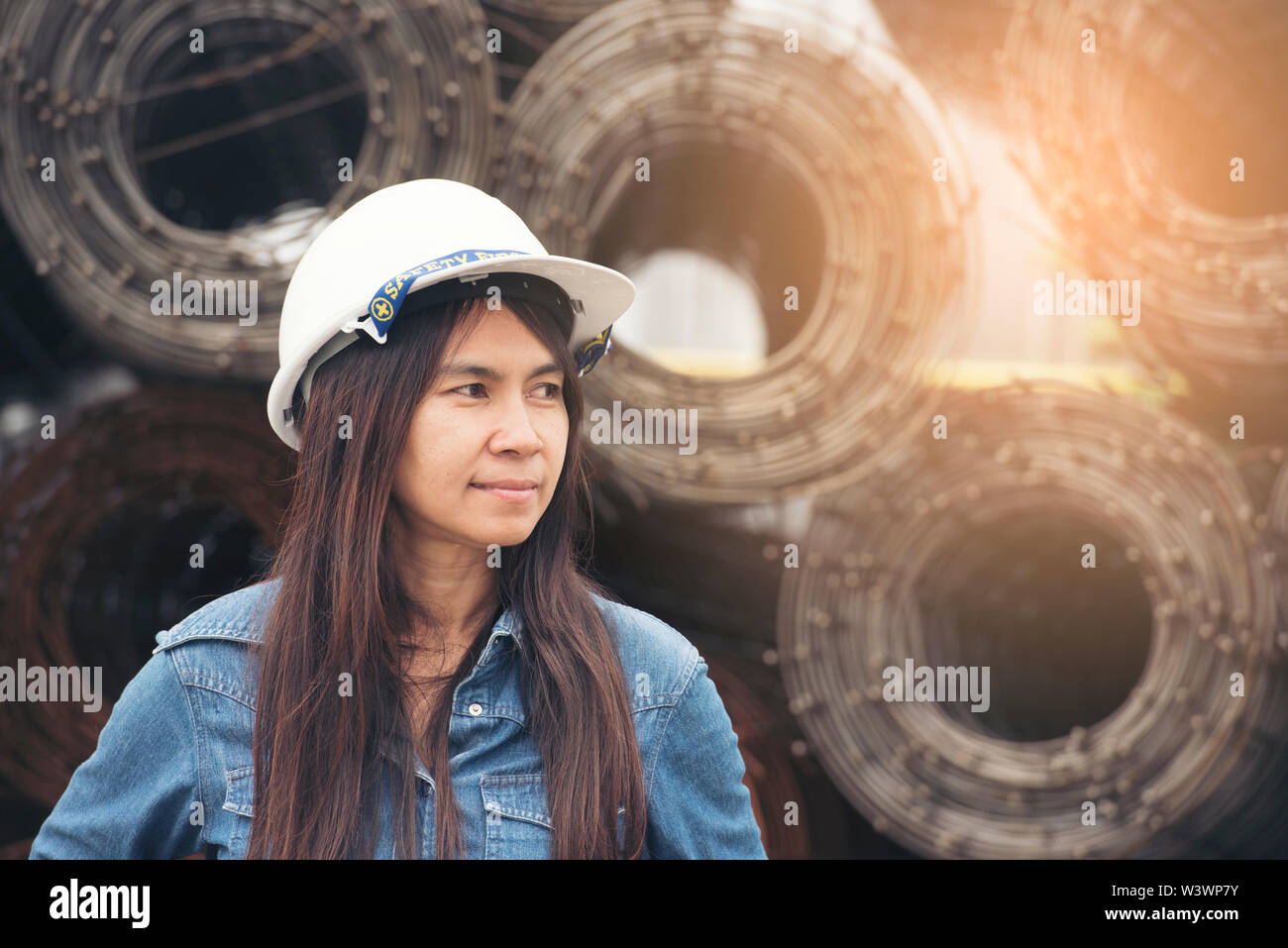 Beautiful Engineer wear White helmet for security work. Construction ...