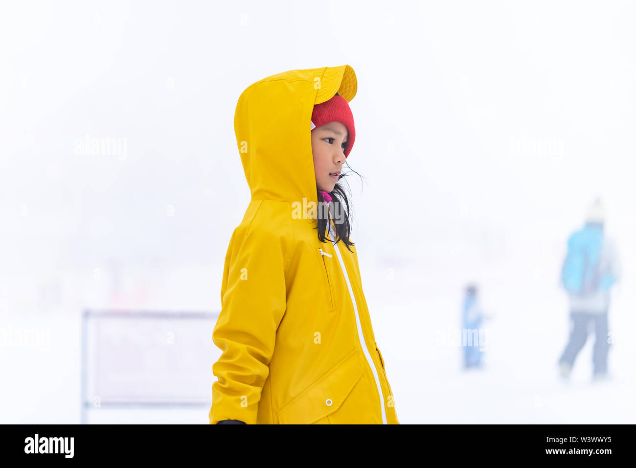 Portrait of Asian kid gril in yellow winter clothing Stock Photo - Alamy